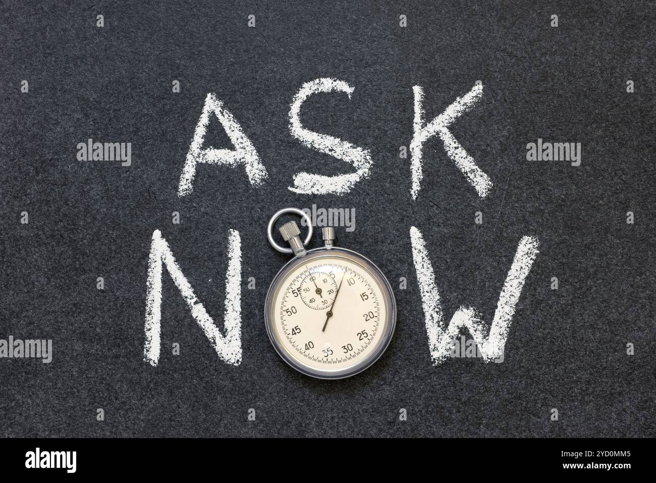 ask now phrase handwritten on chalkboard with vintage precise stopwatch ...