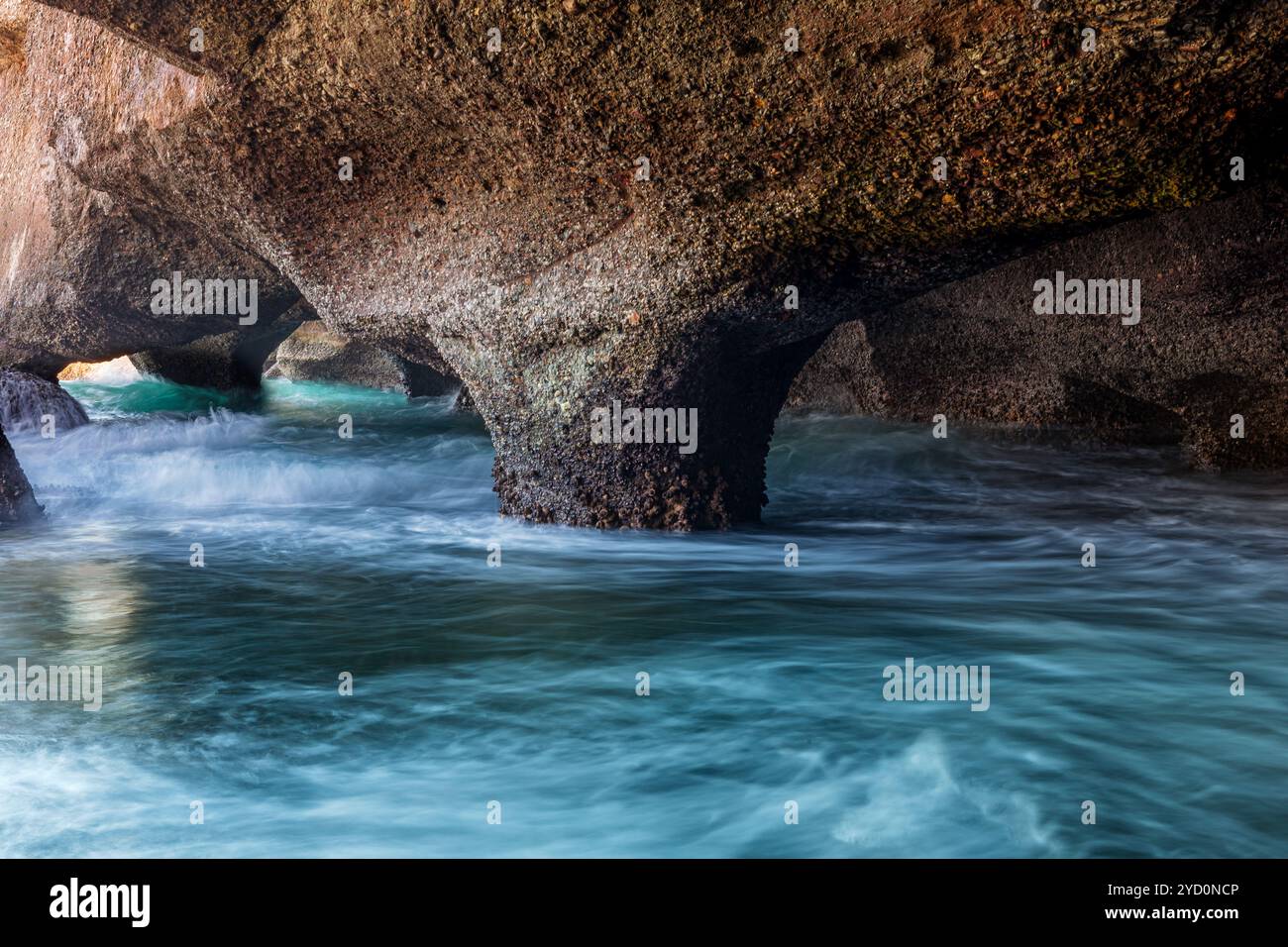 Exploring sea caves along the coastline that have formed and eroded ...