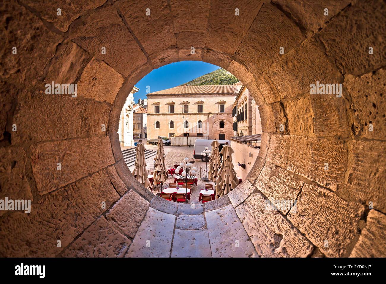 Dubrovnik historic street view through stone carved window Stock Photo ...