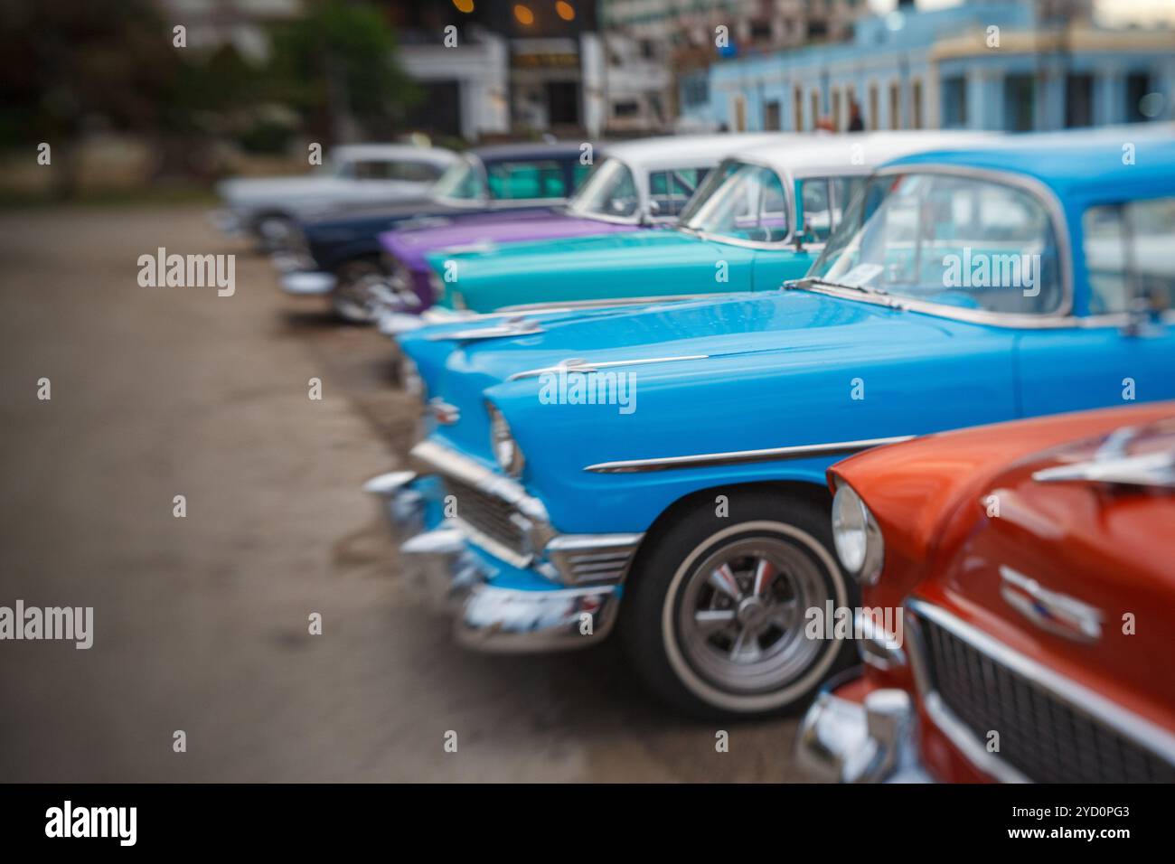 A group of colorful vintage 50s cars parked in a park in Malecon, La ...