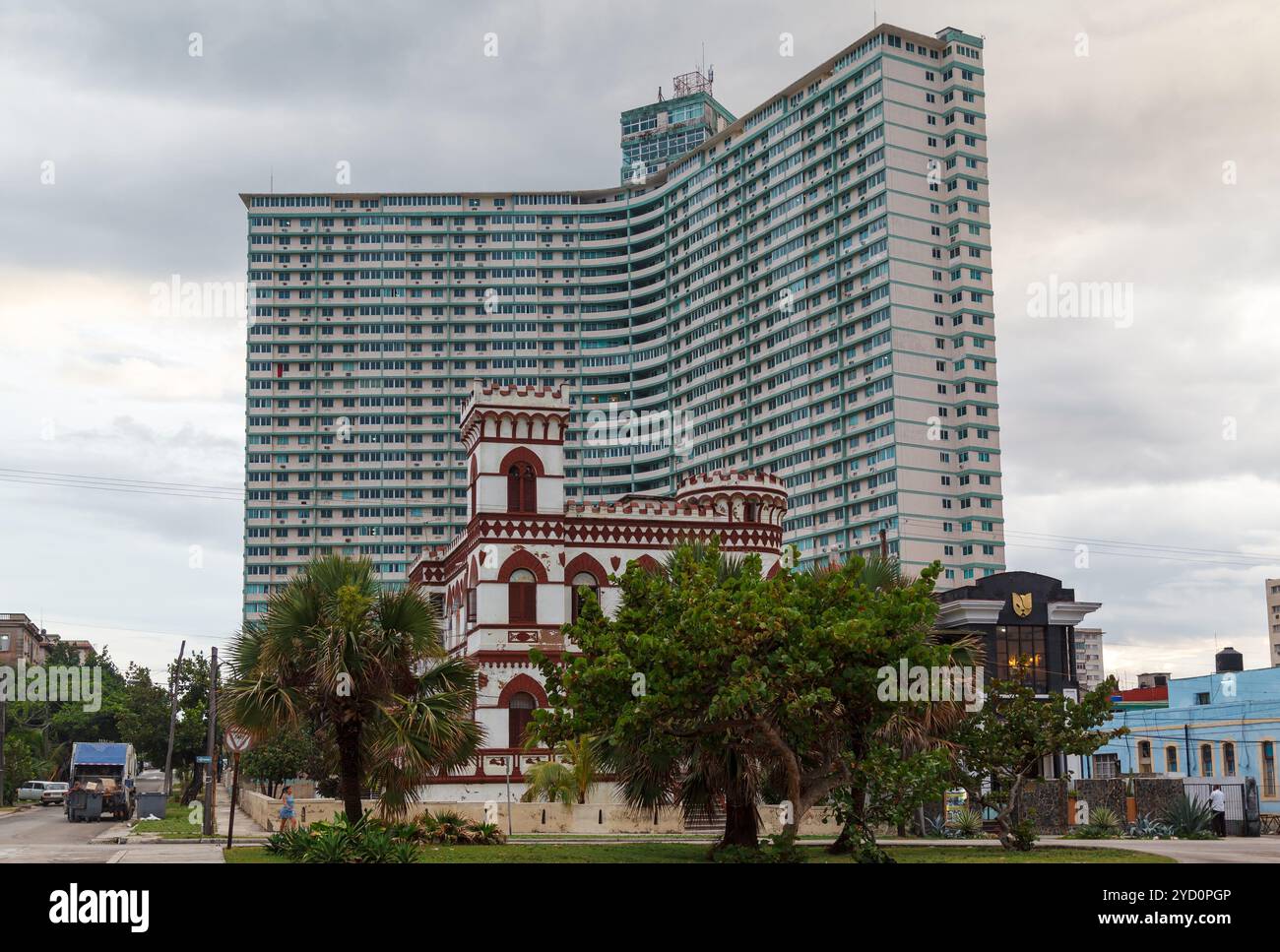 The facade of a Historical building with a turret and Edificio Focsa in La Habana (Havana), Cuba ...