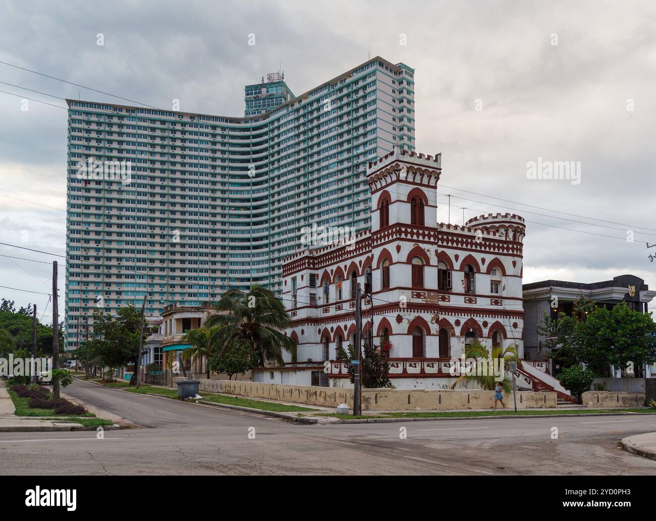 The facade of a Historical building with a turret and Edificio Focsa in ...