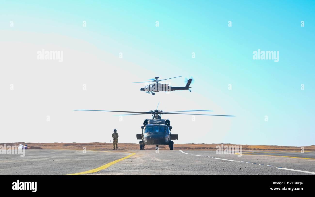 A U.S. Army crew chief for a UH-60 Black Hawk waits for passengers ... A U.S. Army crew chief for a UH-60 Black Hawk waits for passengers ...