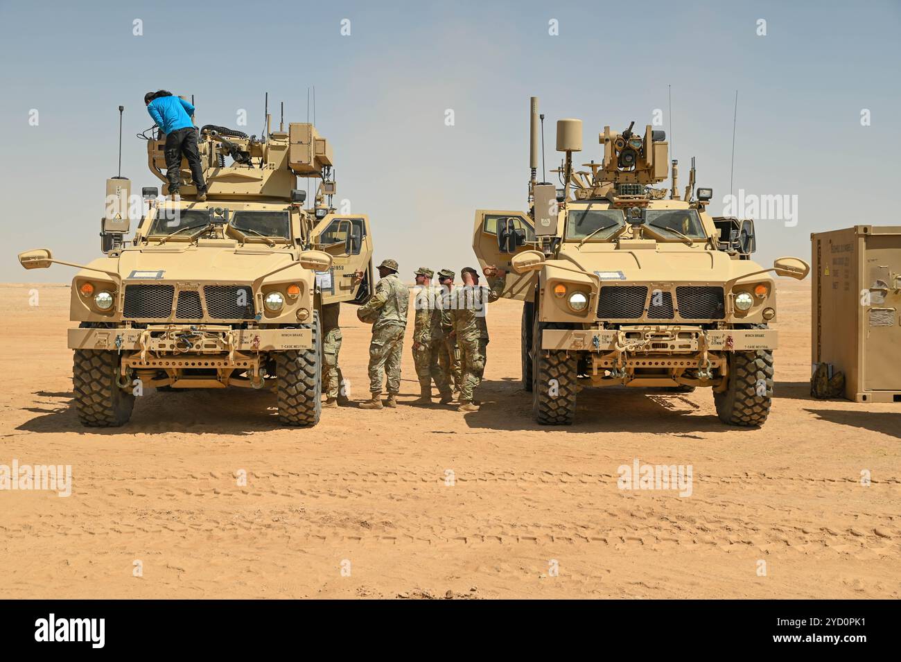 U.S. Army Soldiers conduct final safety checks on the Mobile-Low, slow ...