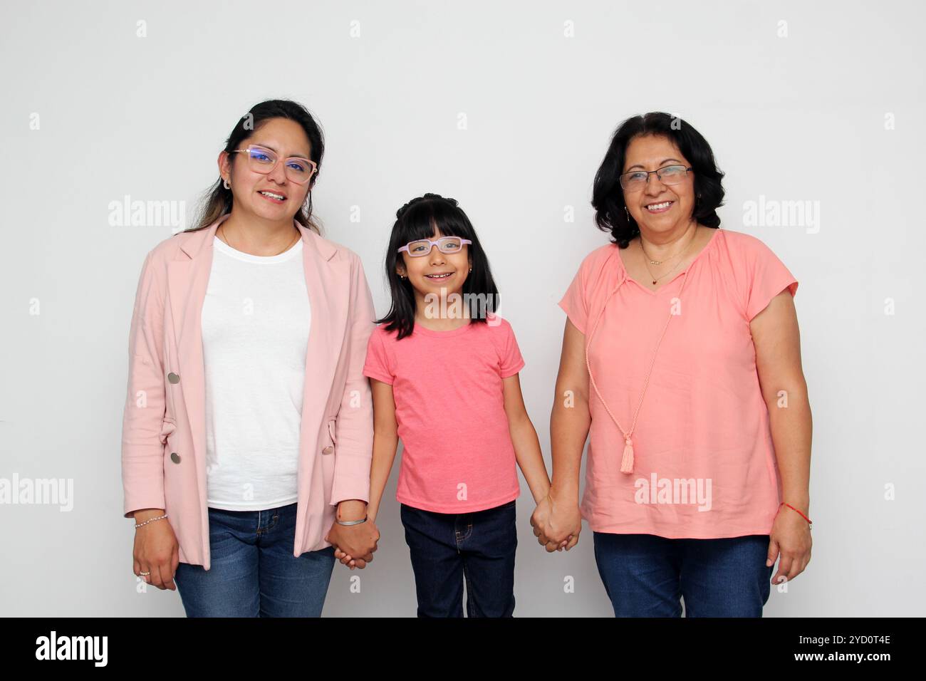 Three generations of brunette Latina women with glasses, grandmother ...