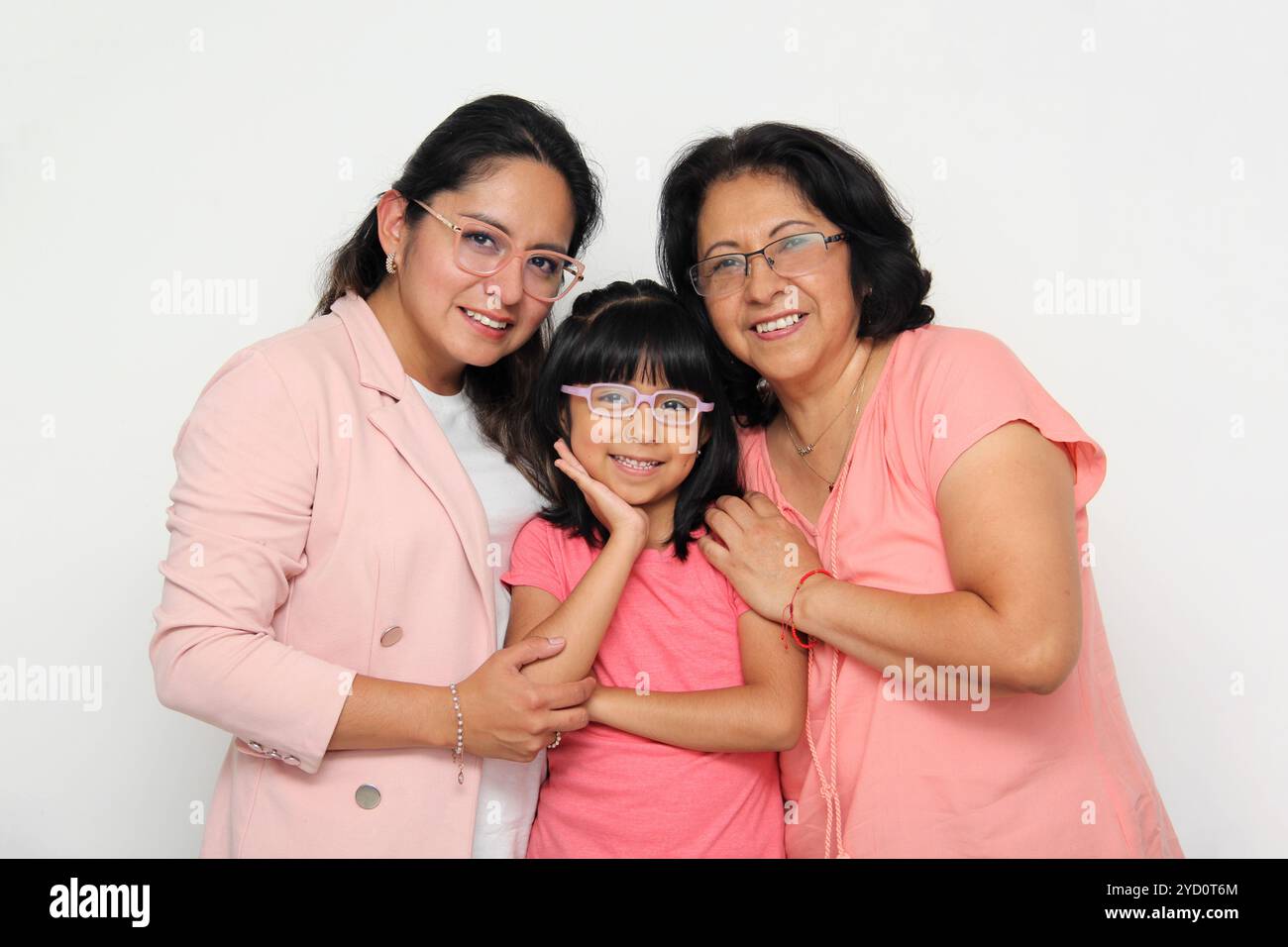 Three generations of brunette Latina women with glasses, grandmother ...