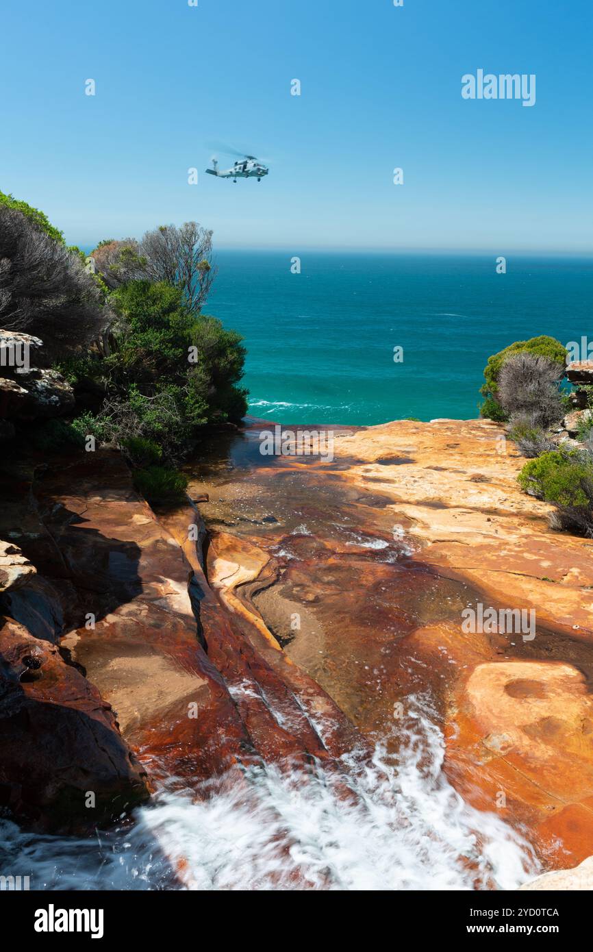 The army helicopter coming in close to view the waterfalls Stock Photo ...