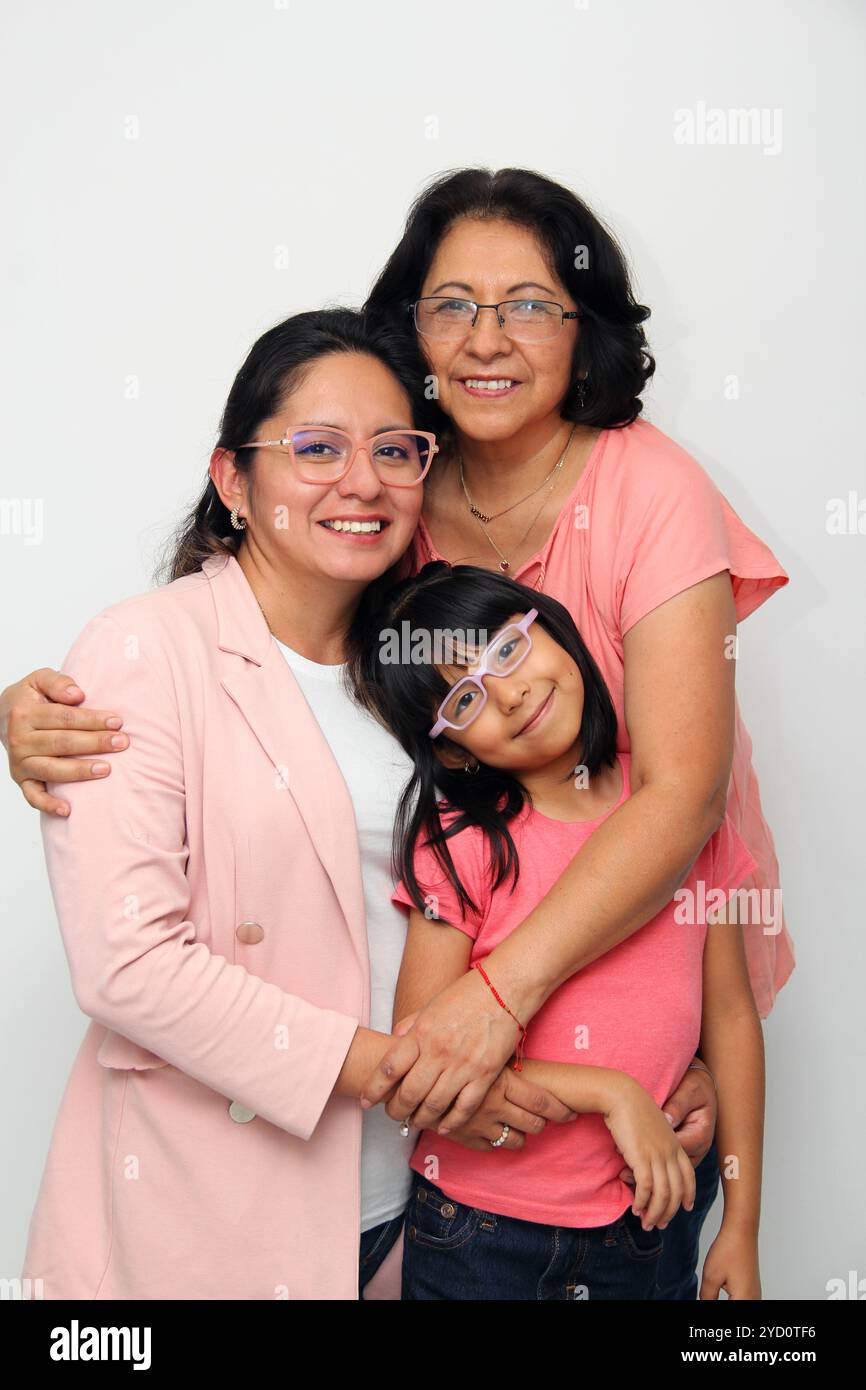 Three generations of brunette Latina women with glasses, grandmother ...