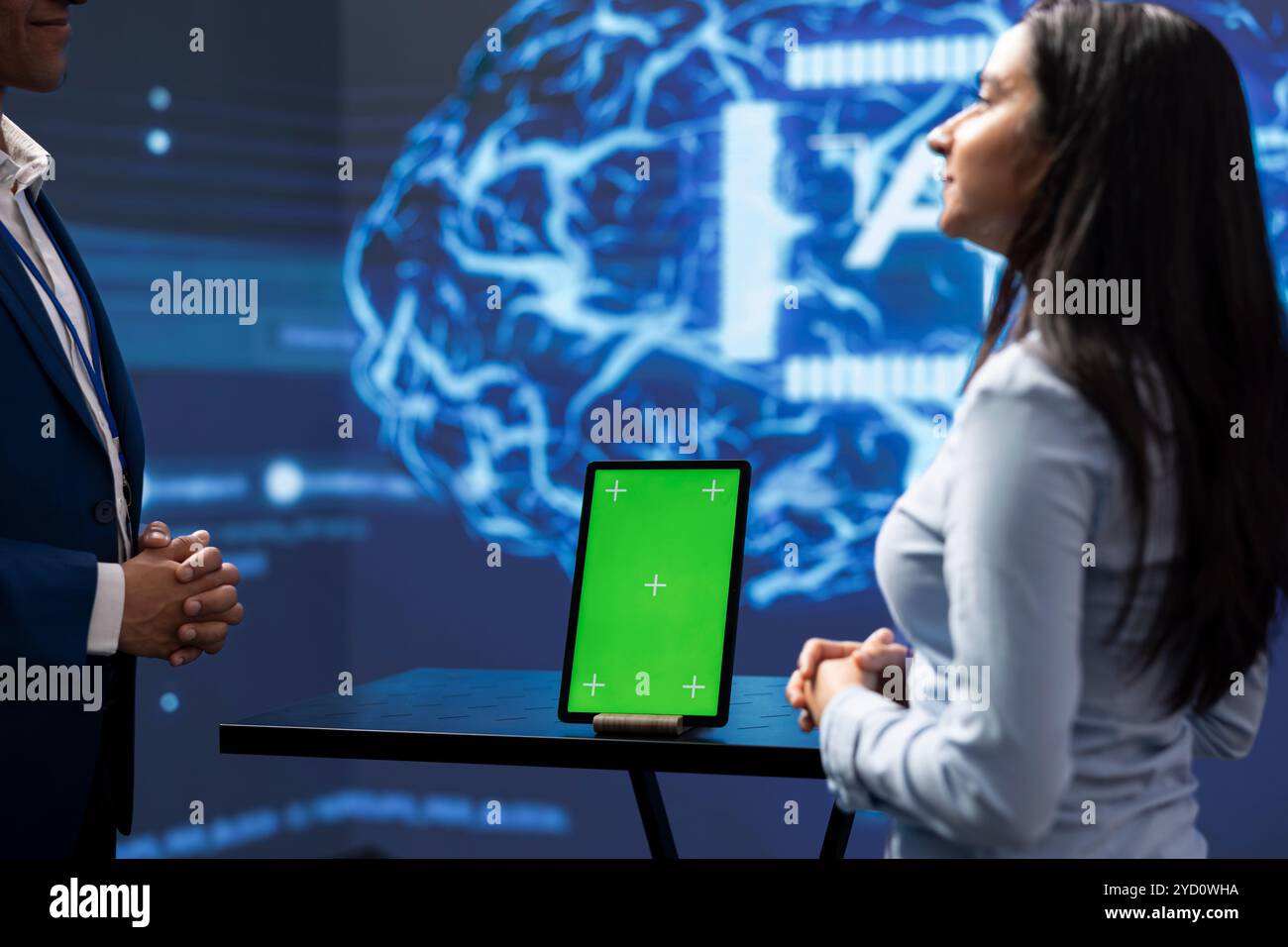 Teamworking colleagues in startup doing advancements in AI field using chroma key tablet. Mockup ...