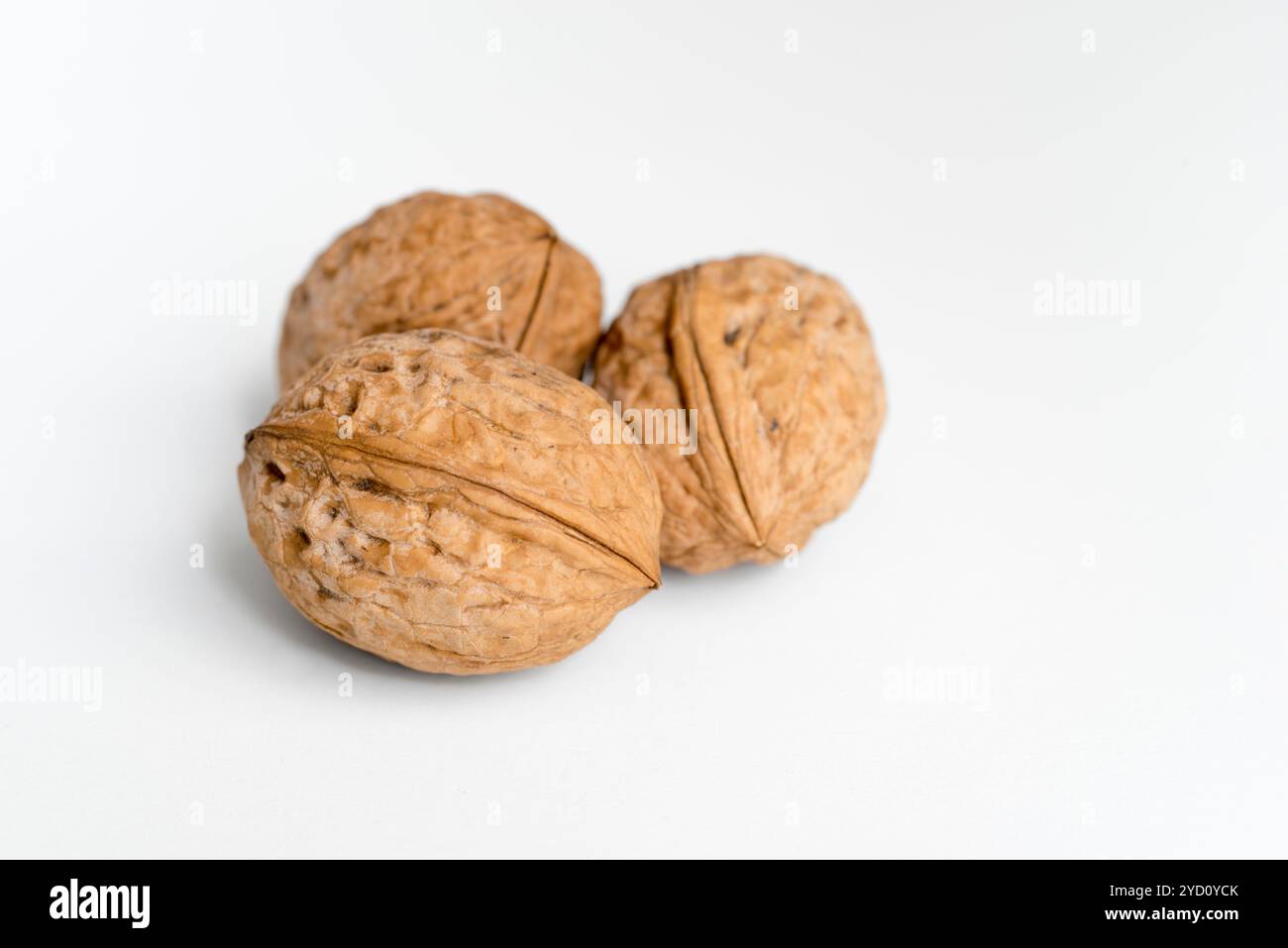 three walnuts isolated on white background Stock Photo - Alamy