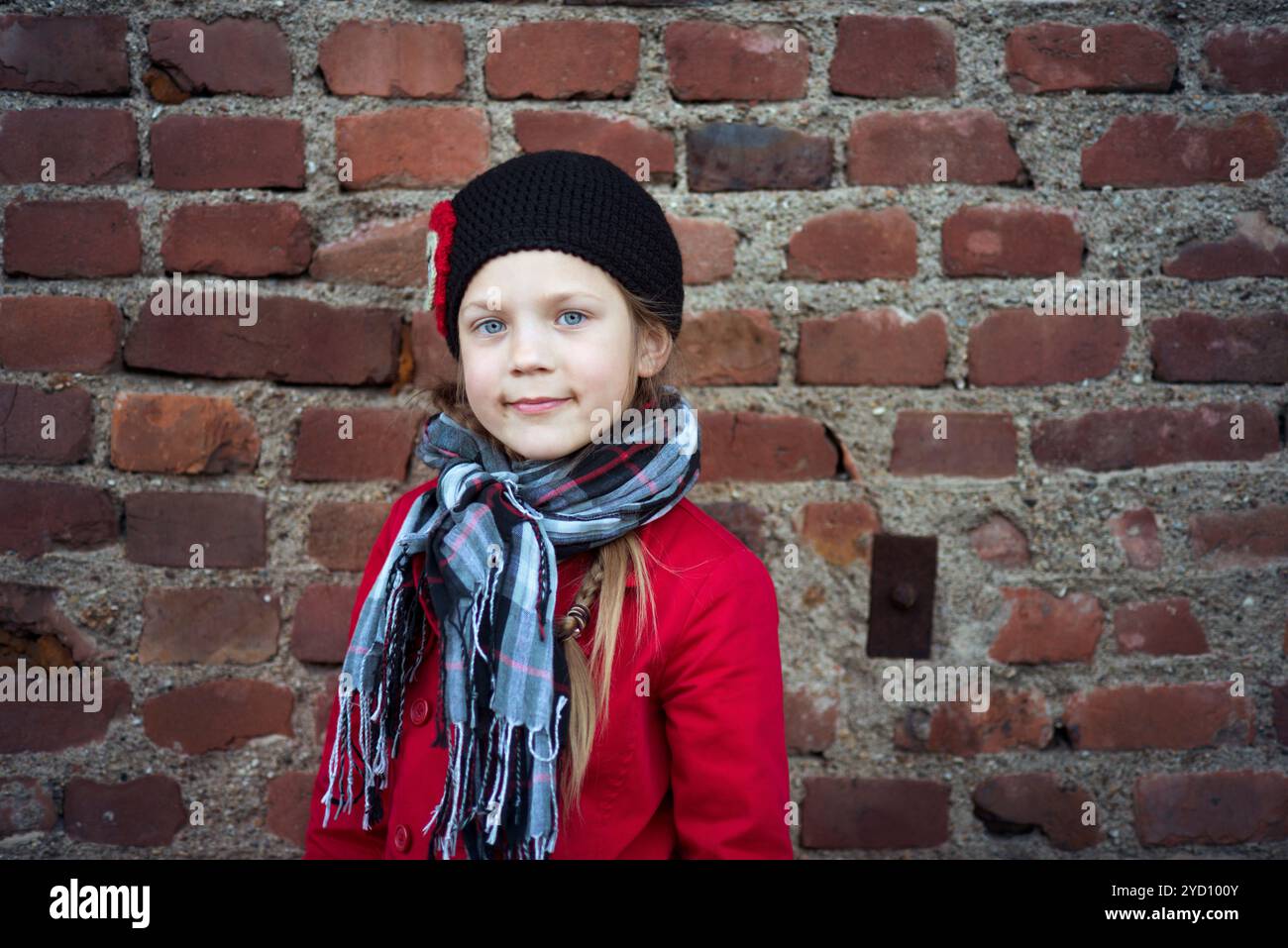 Girl near brick wall Stock Photo - Alamy