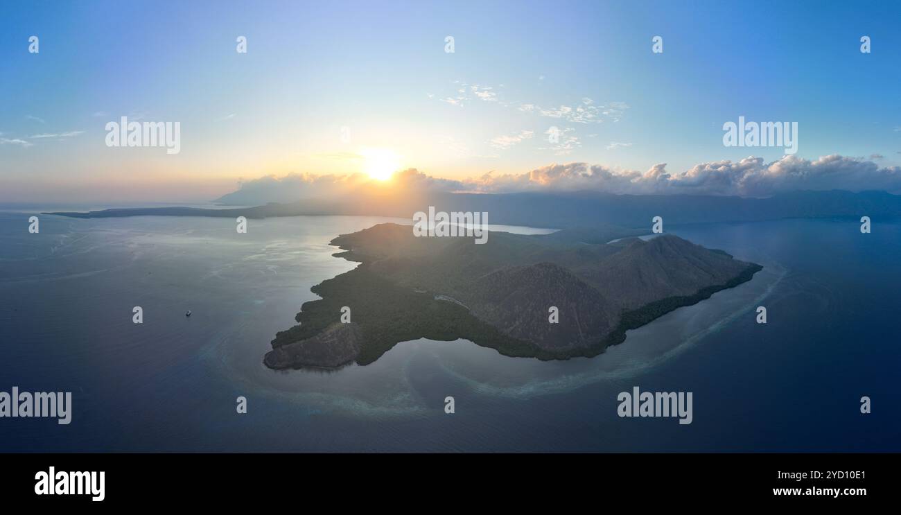 Daybreak illuminates the scenic island of Lembata in Indonesia. This ...