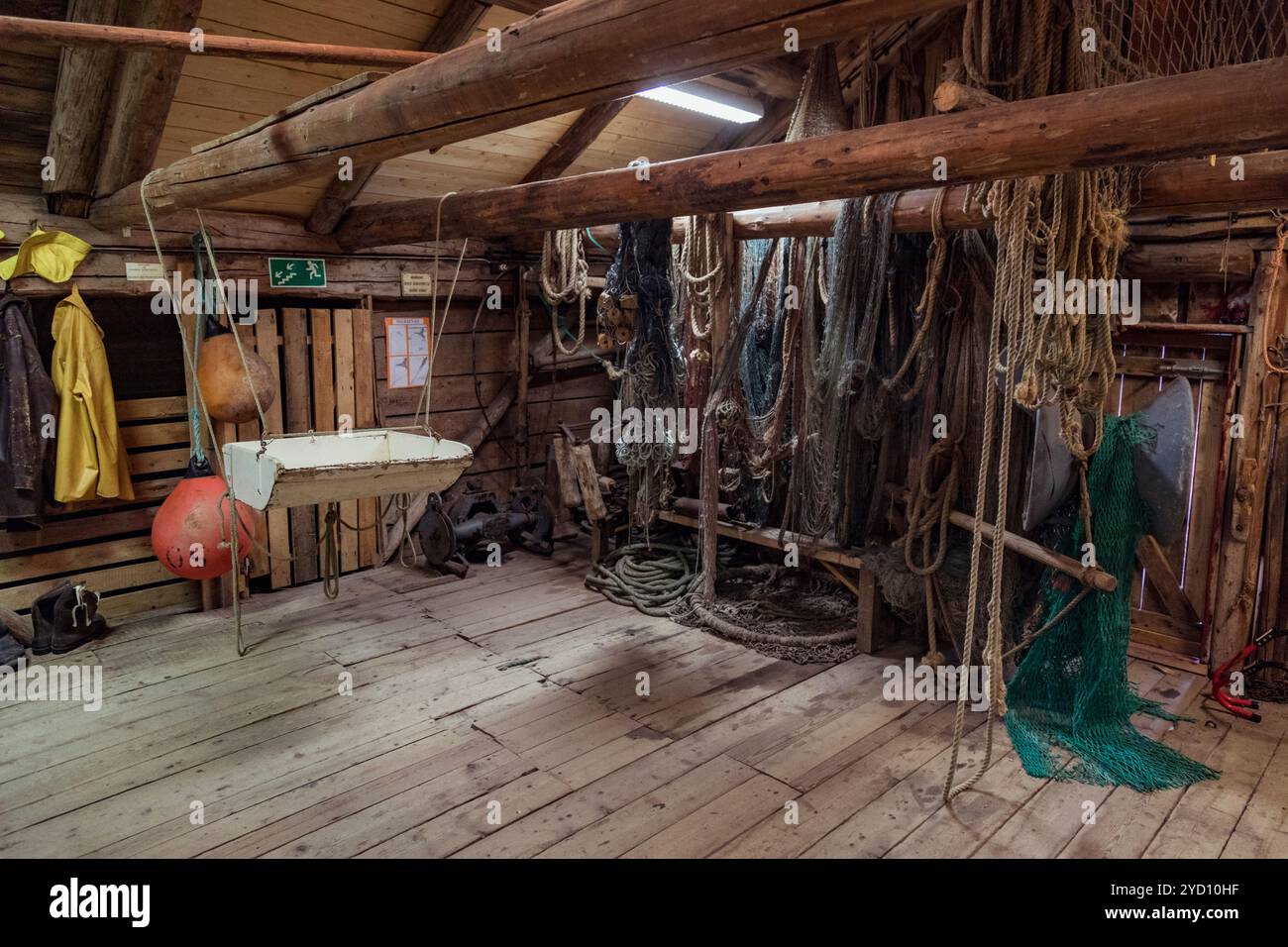 A traditional log cabin in the Lofoten Islands features wooden flooring ...
