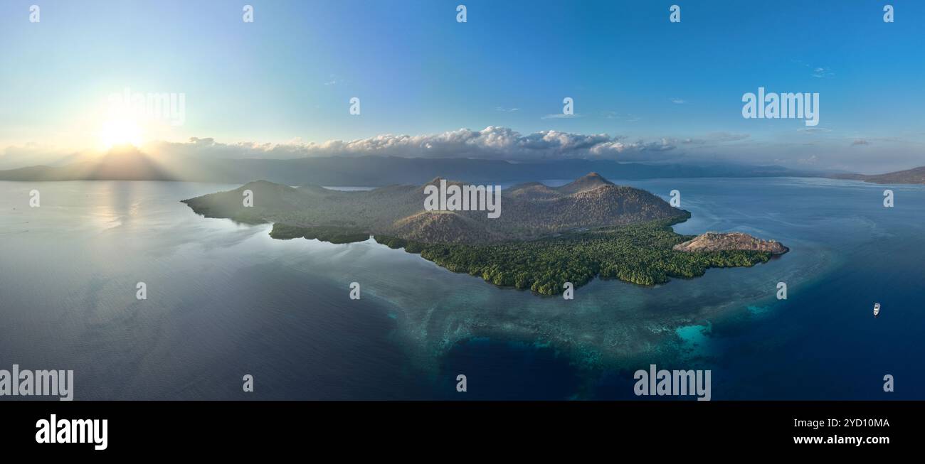 Daybreak illuminates the scenic island of Lembata in Indonesia. This ...