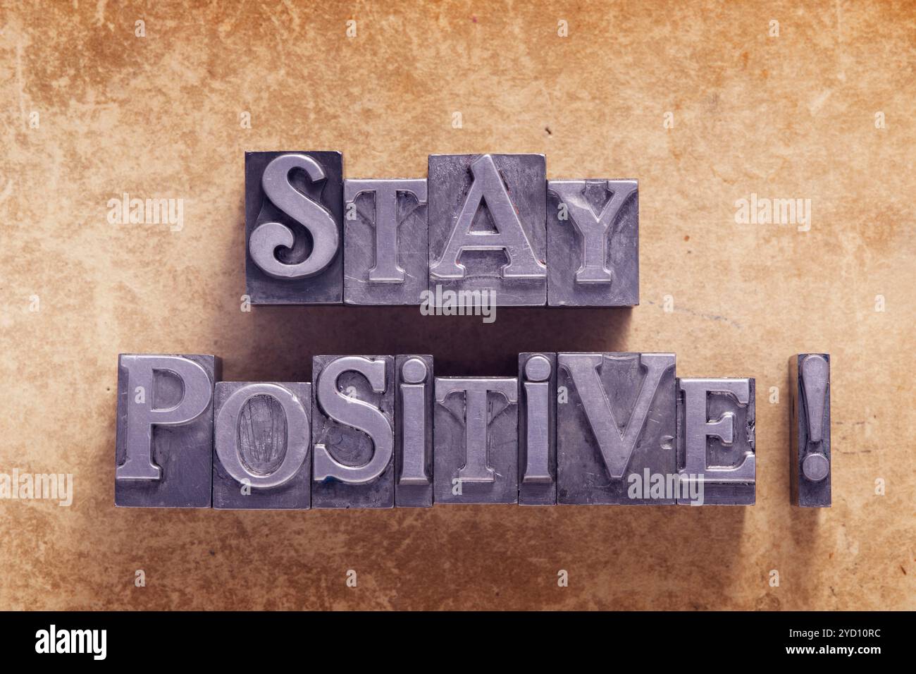 stay positive exclamation made from metallic letterpress type on ...