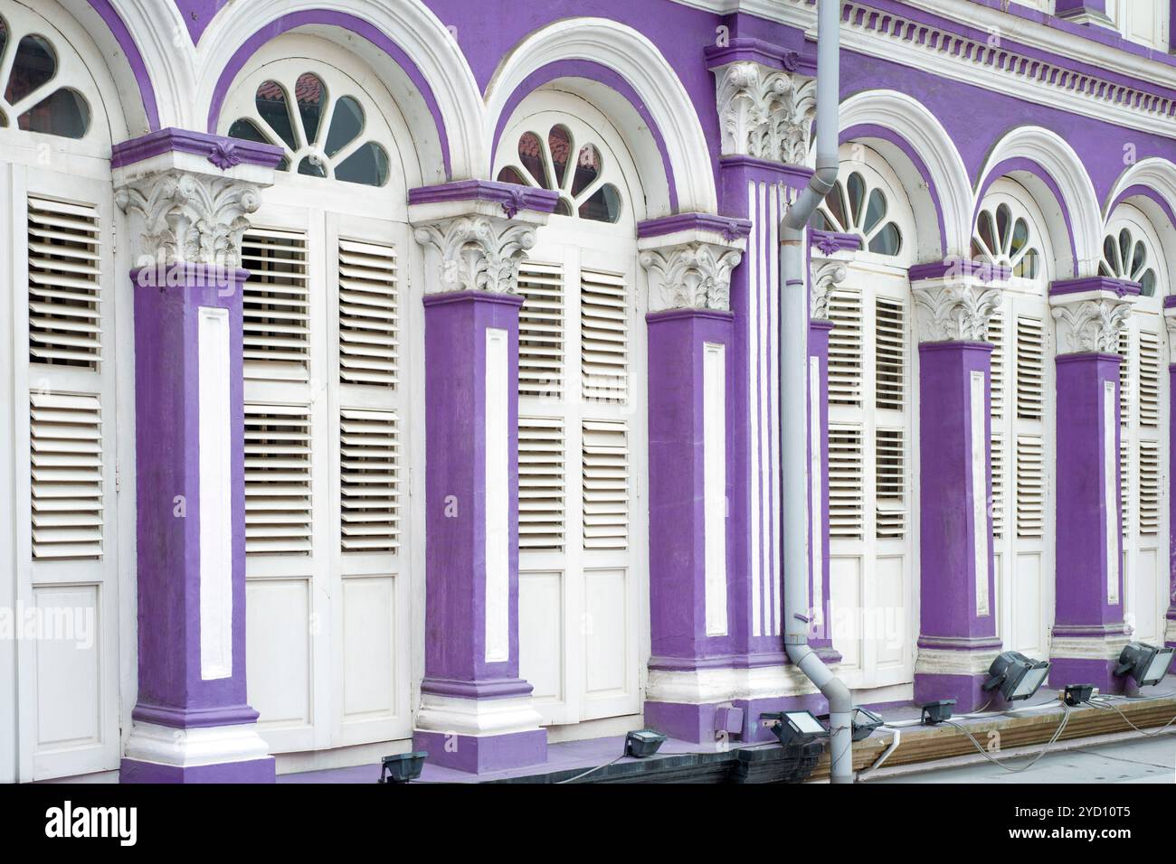purple building walls in Singapore Chinatown with traditional wooden ...