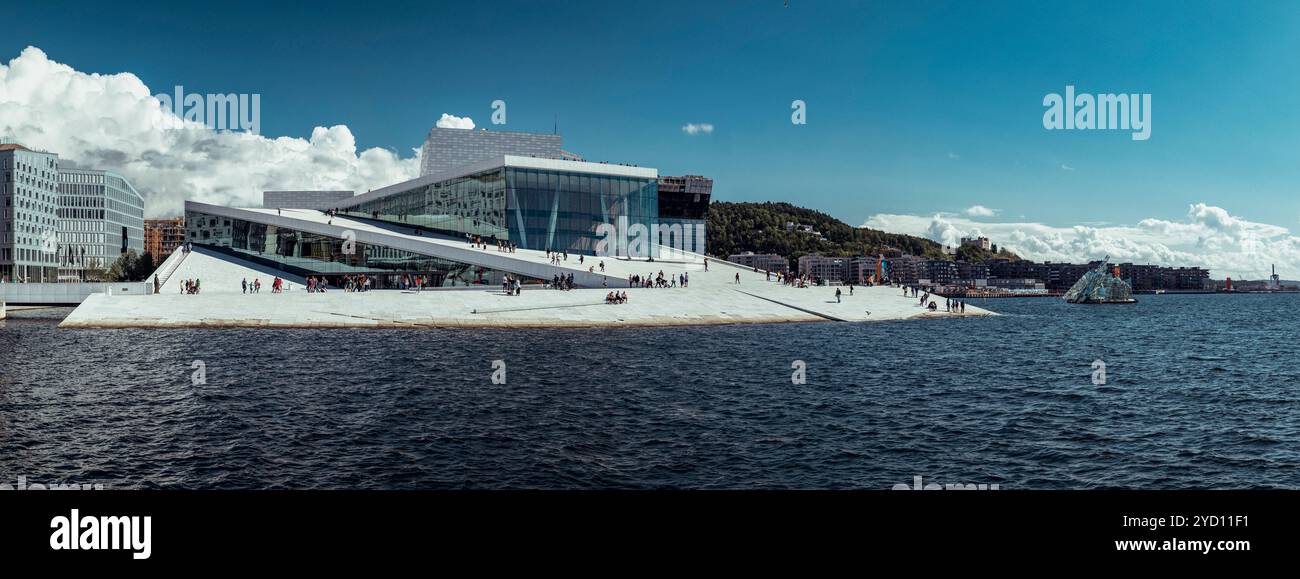 Visitors enjoy a winter day outside the modern Oslo Opera House ...