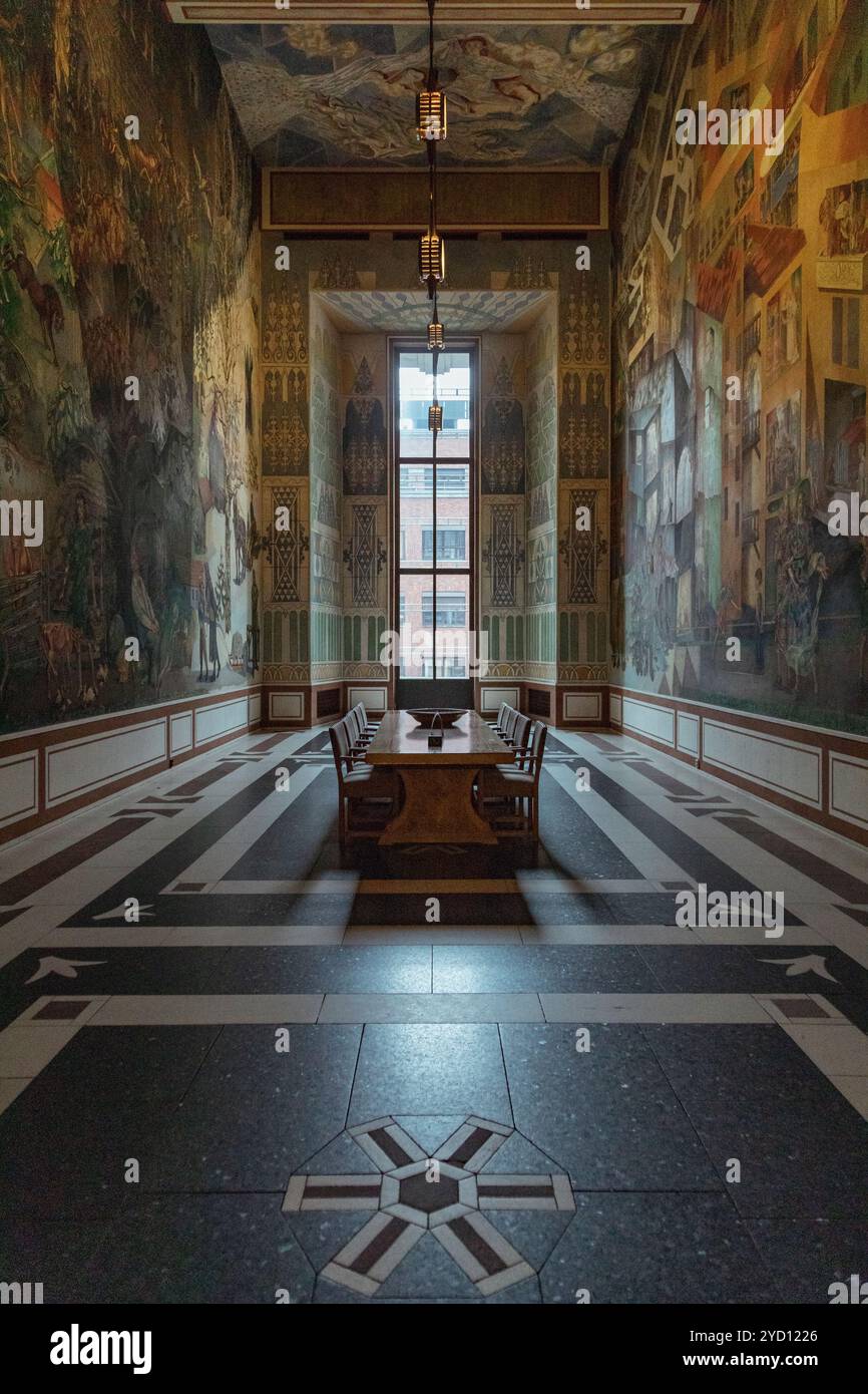 The elegant interior of Oslo's City Hall showcases vibrant murals and a ...