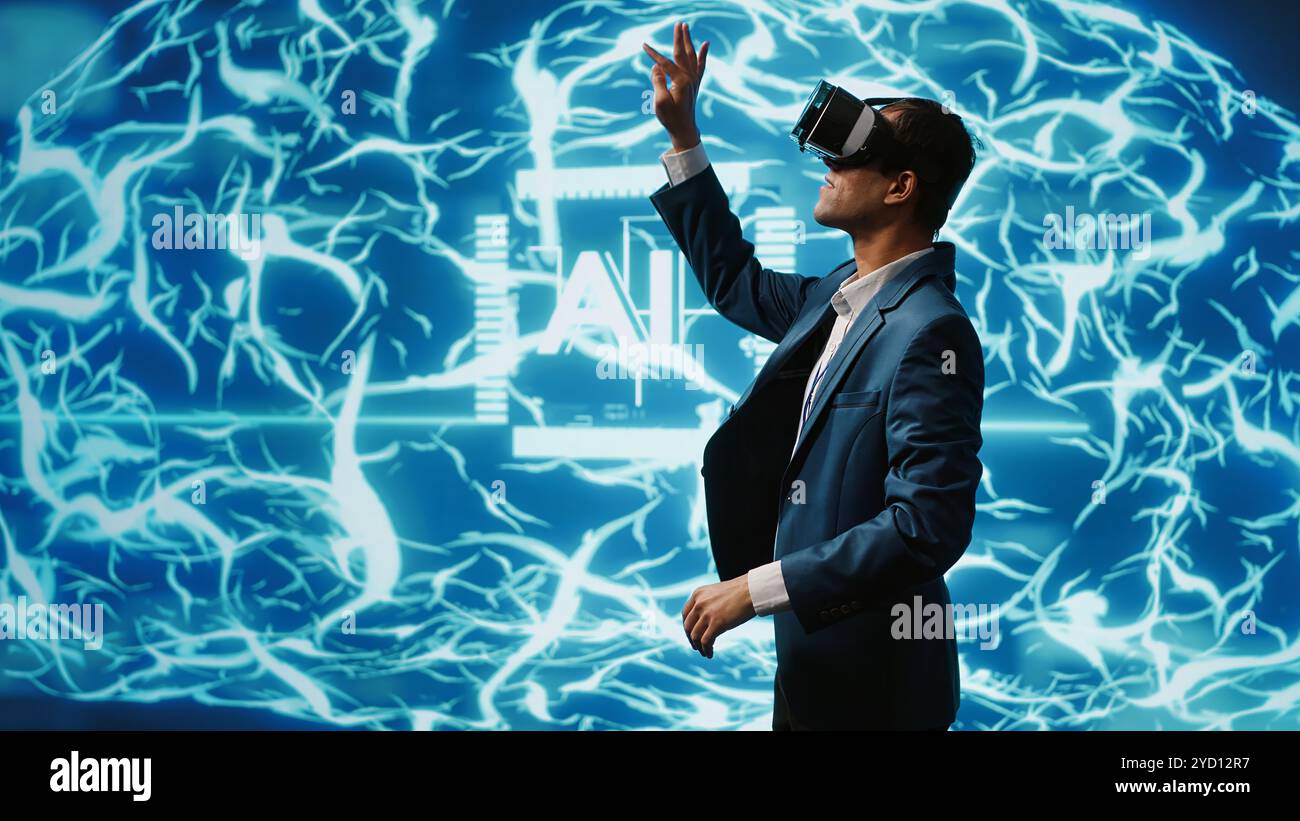 System administrator wearing VR headset looking at hologram of ...