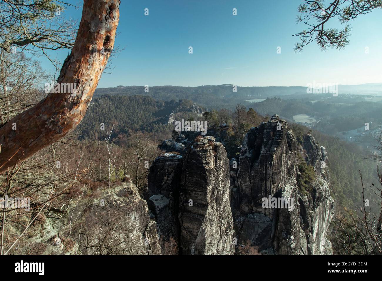 Towering rock formations dominate the landscape, surrounded by a ...
