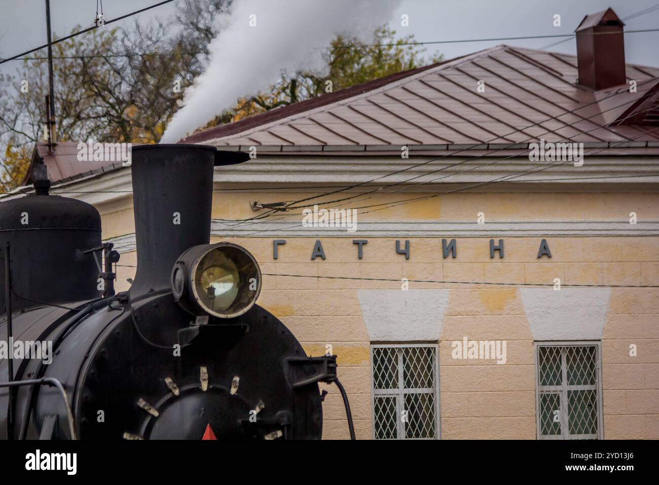 Old Russian locomotive on the railway. Old black locomotive. Smoke from ...