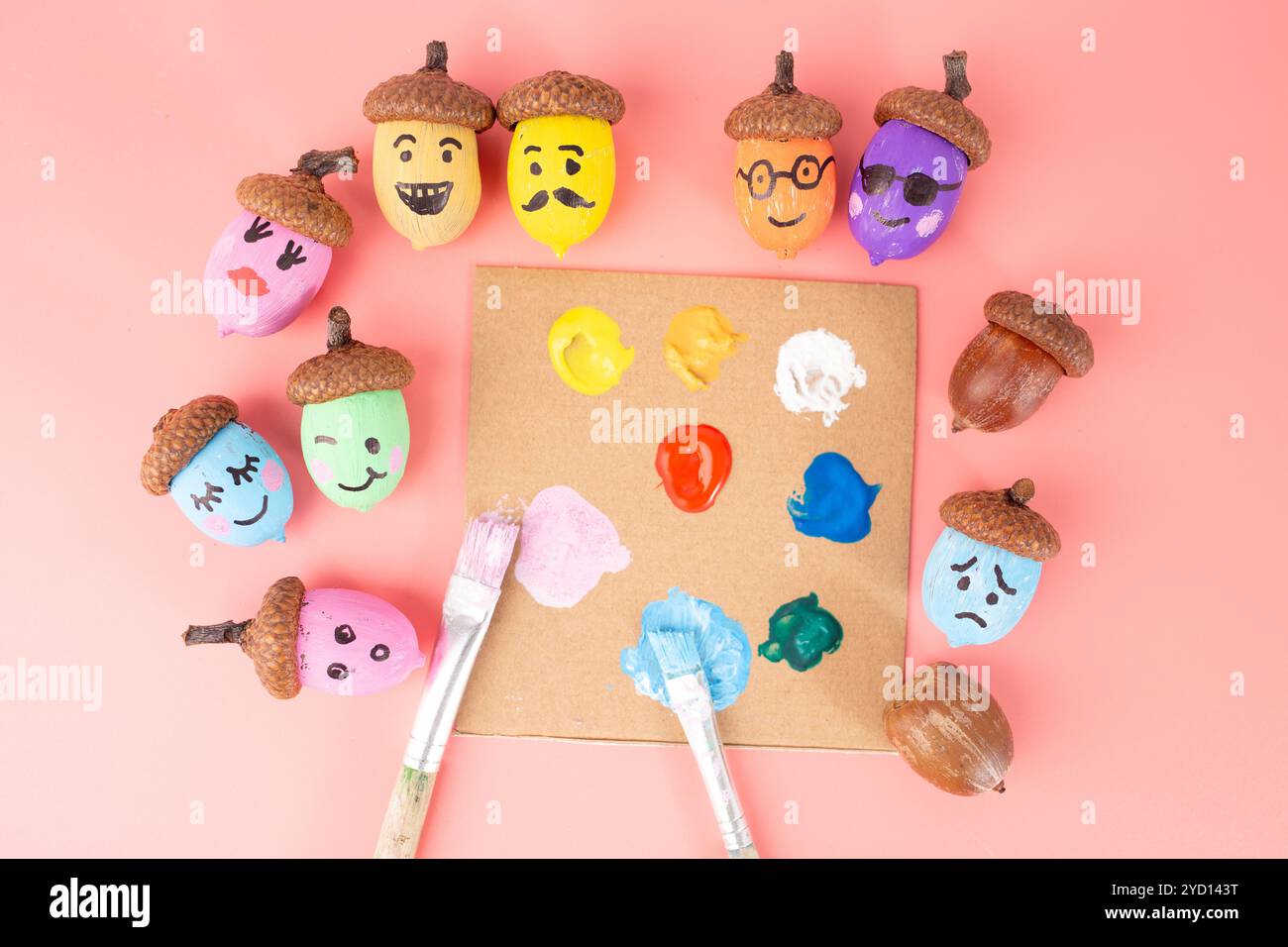 a collection of acorns that have been painted in various bright colors ...