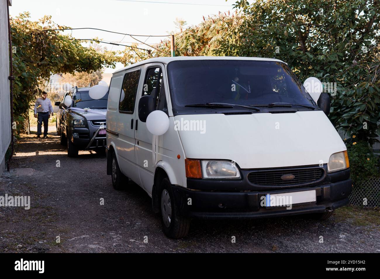 Festively Decorated White Van with Balloons in Driveway Scene Stock ...