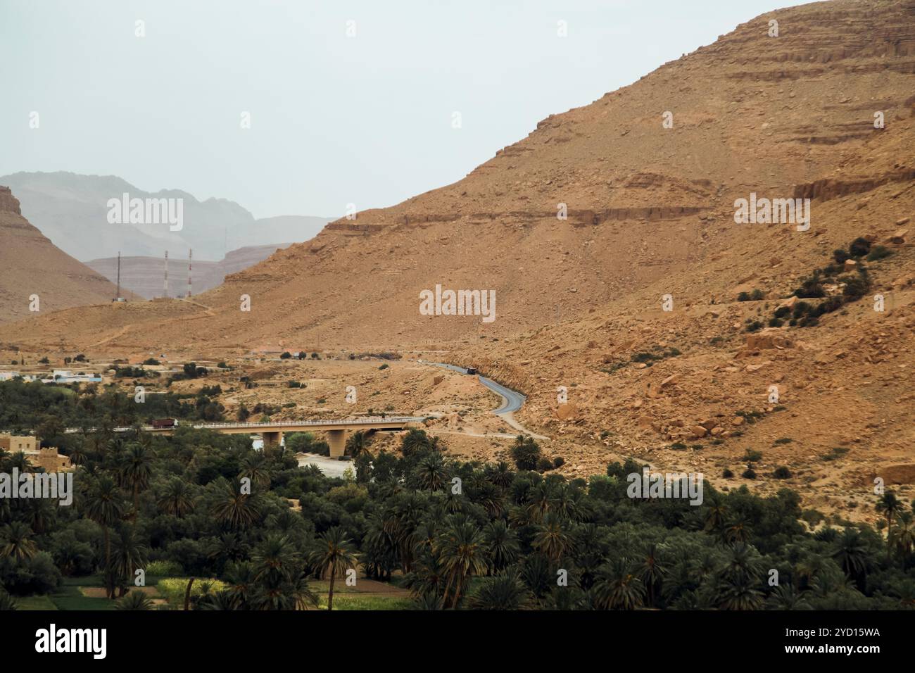 A winding road meanders through the rugged terrain of Morocco's ...