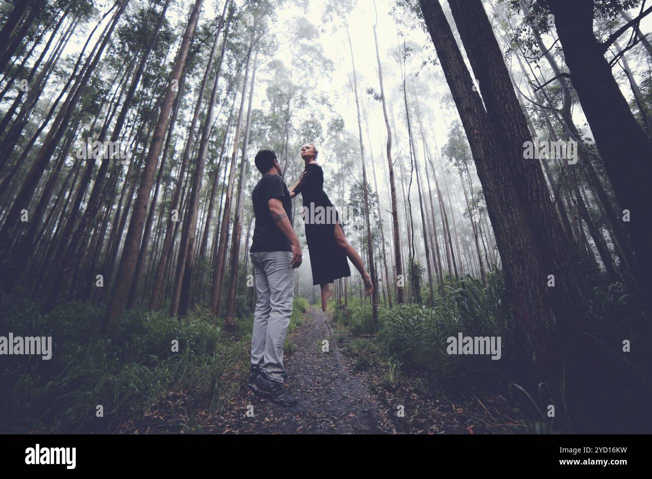 woman removing man from earth Stock Photo - Alamy