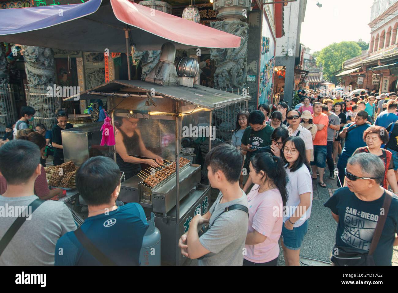 Taipei, Taiwan - October 10th 2019: Crowds gather at a bustling street ...