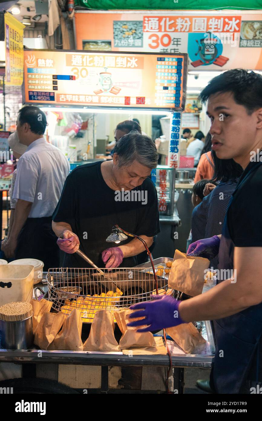 Taipei, Taiwan - October 10th 2019: Exploring the vibrant street food culture of Taipei at a ...