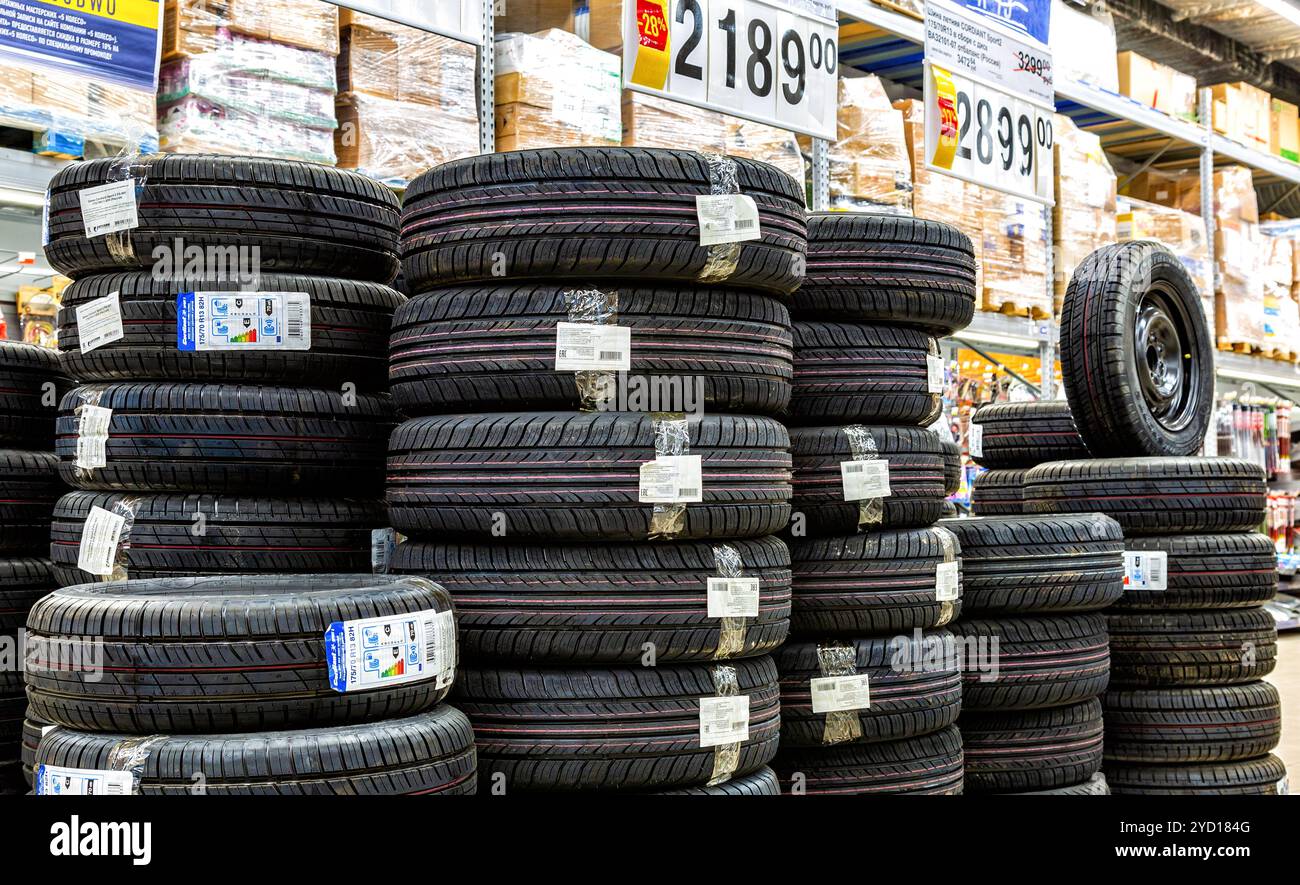 Vehicle tires stacked up for sale in the store Stock Photo - Alamy