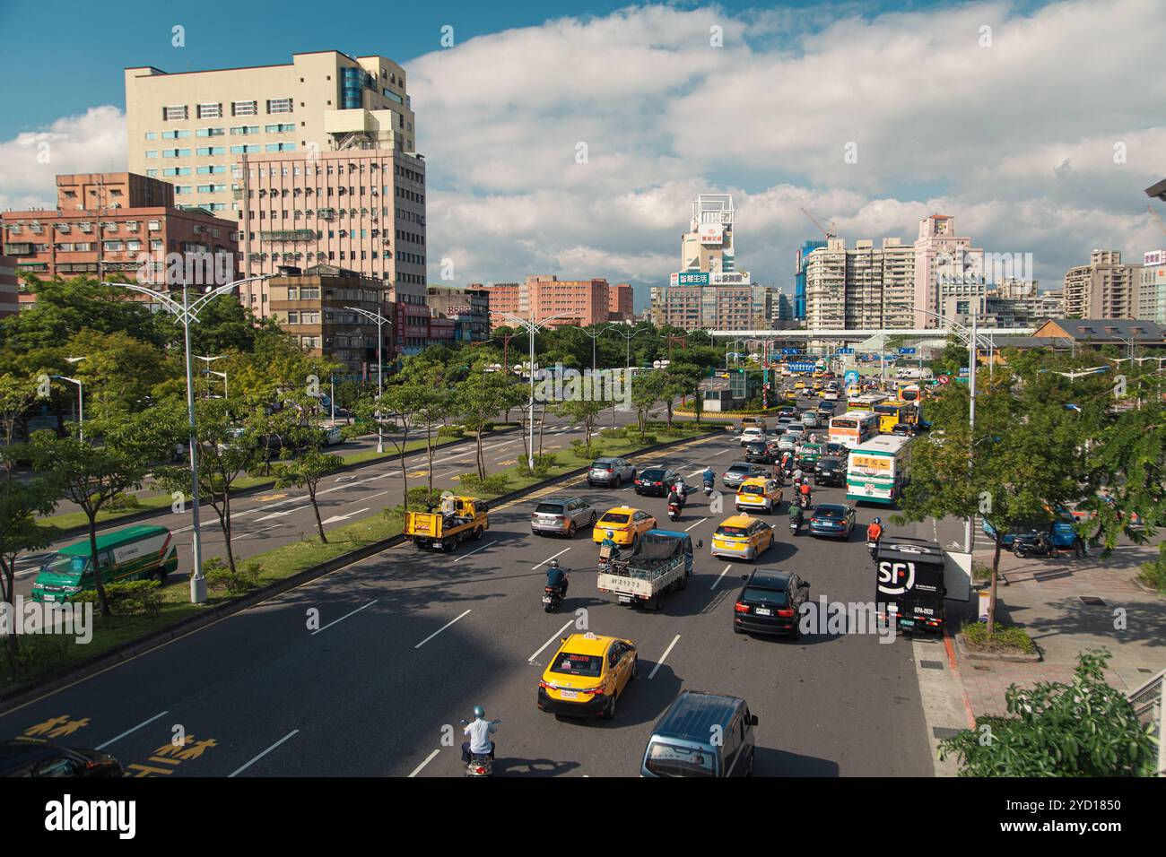 The streets of Taipei are alive with traffic as various vehicles ...
