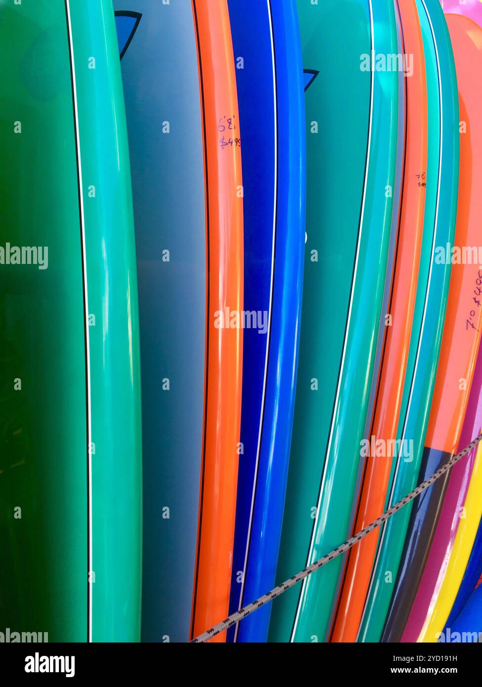 Surf boards lined up for sale Stock Photo - Alamy