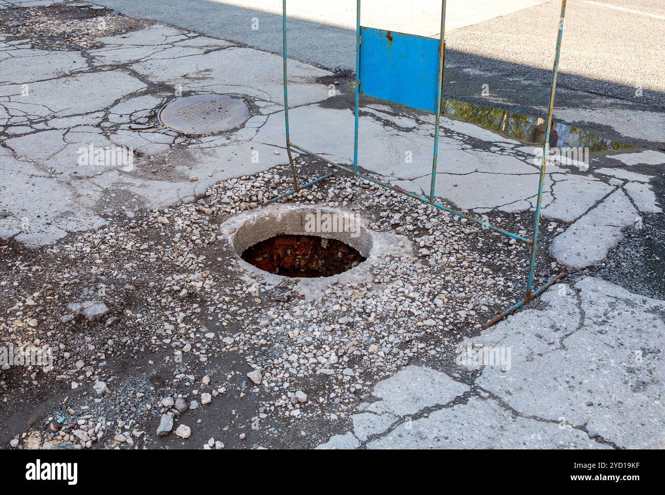 Broken manhole cover hi-res stock photography and images - Alamy