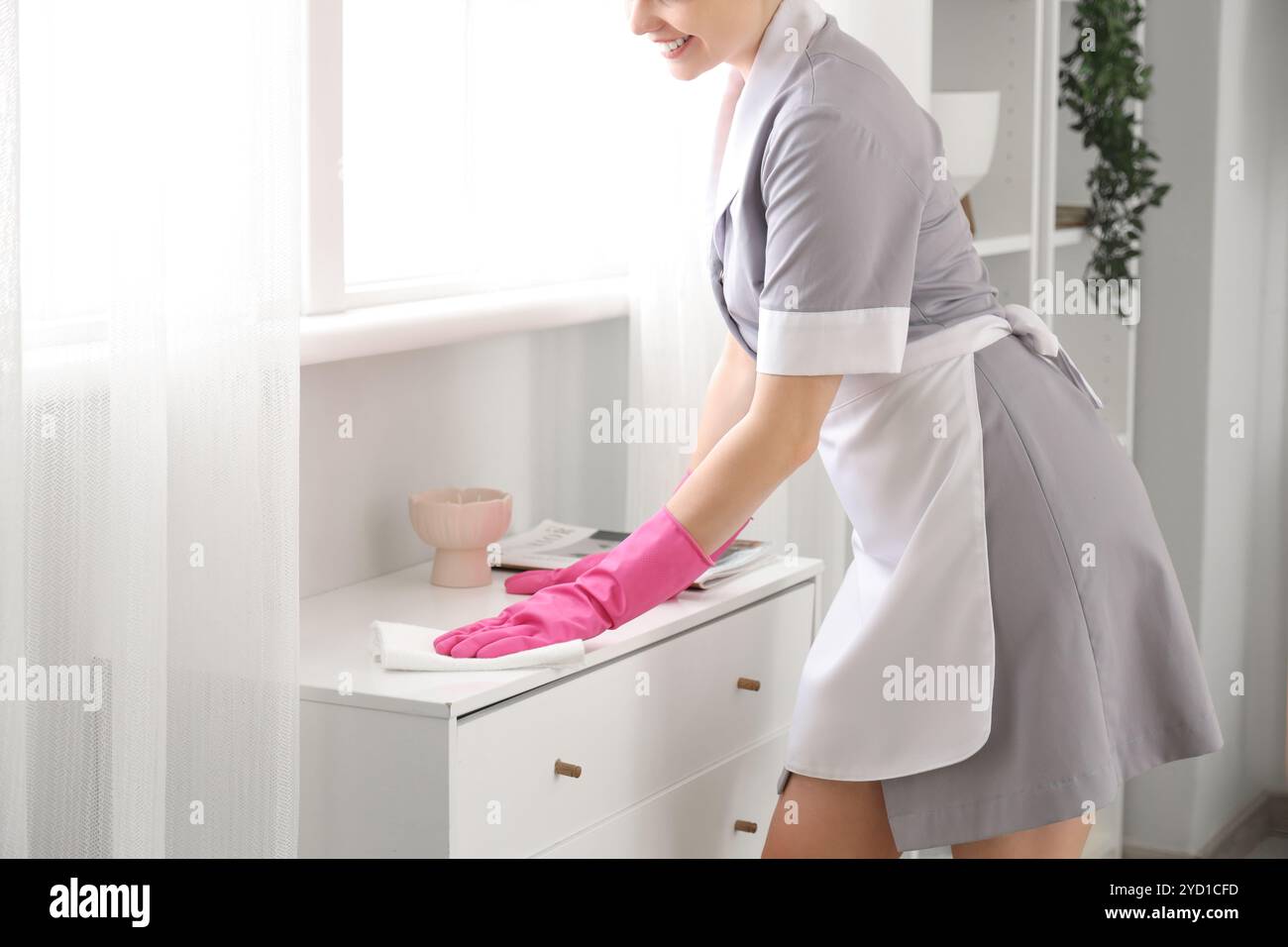 Young chambermaid cleaning hotel room Stock Photo - Alamy