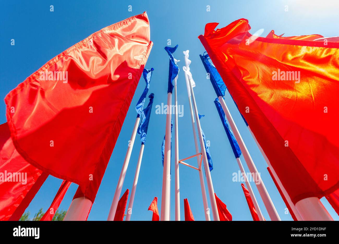 Vibrant red flag fluttering hi-res stock photography and images - Alamy