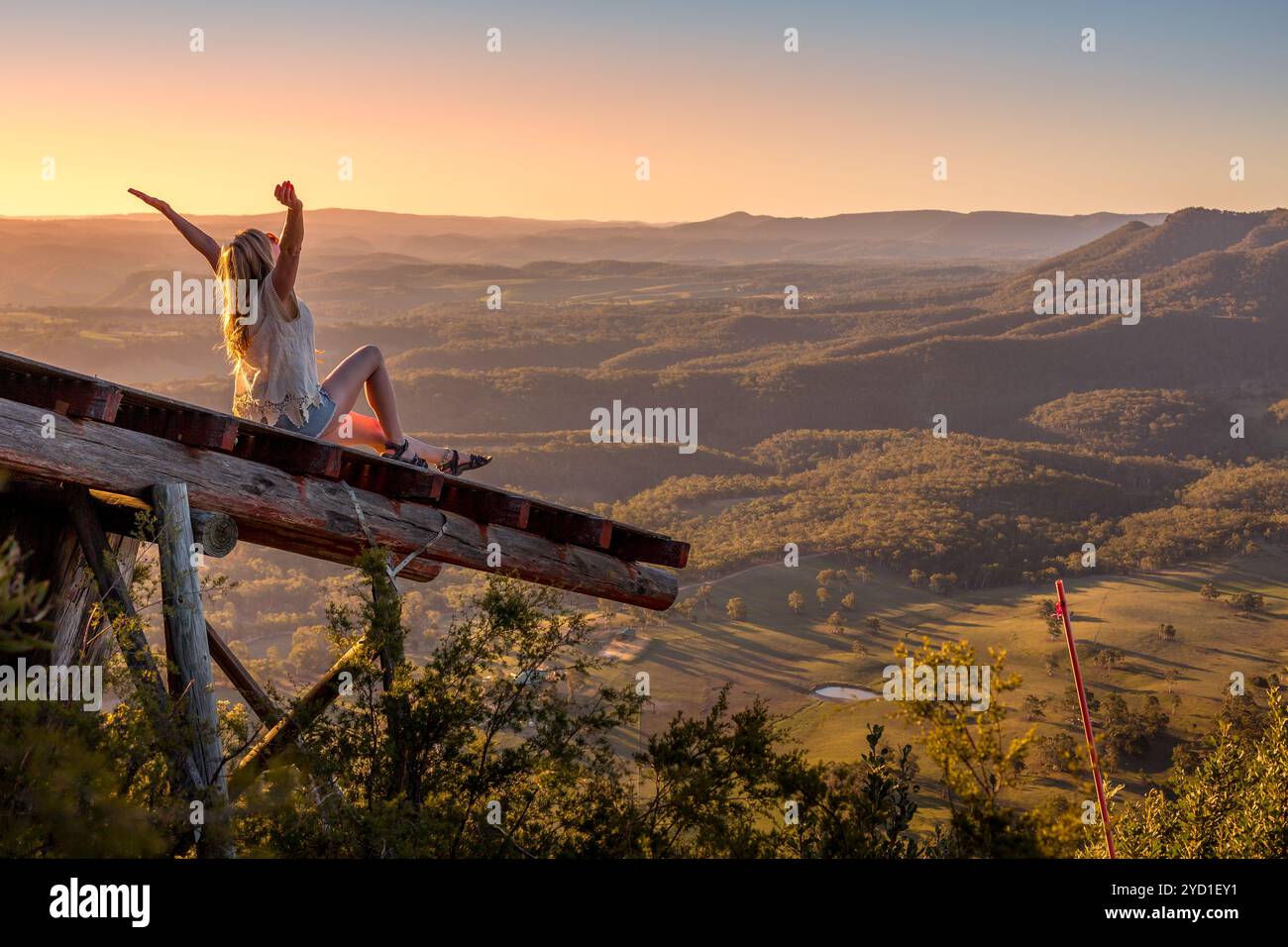 Woman arms outstretched embrace each day Stock Photo - Alamy