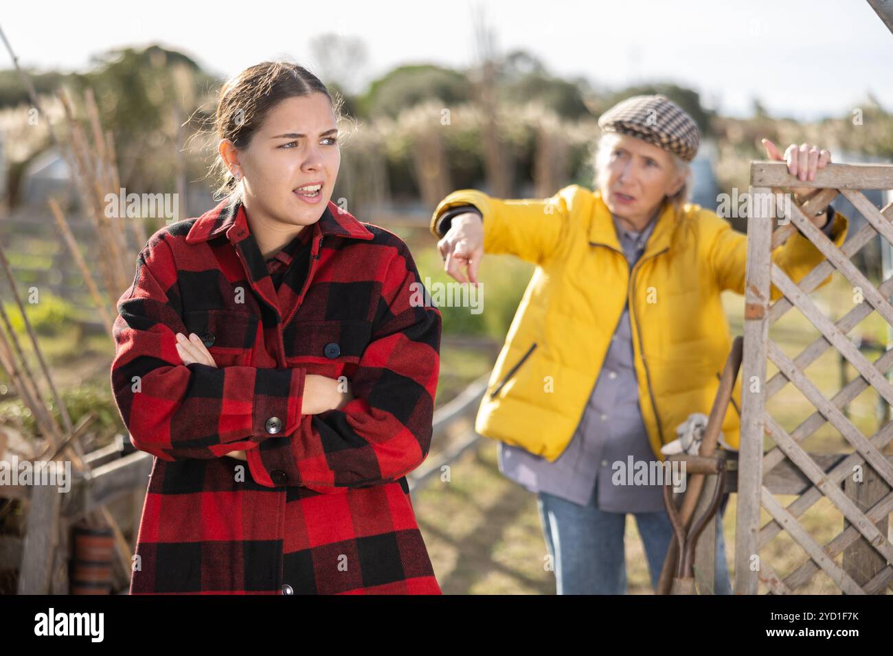 Conflict between female neighbors in country farm Stock Photo - Alamy