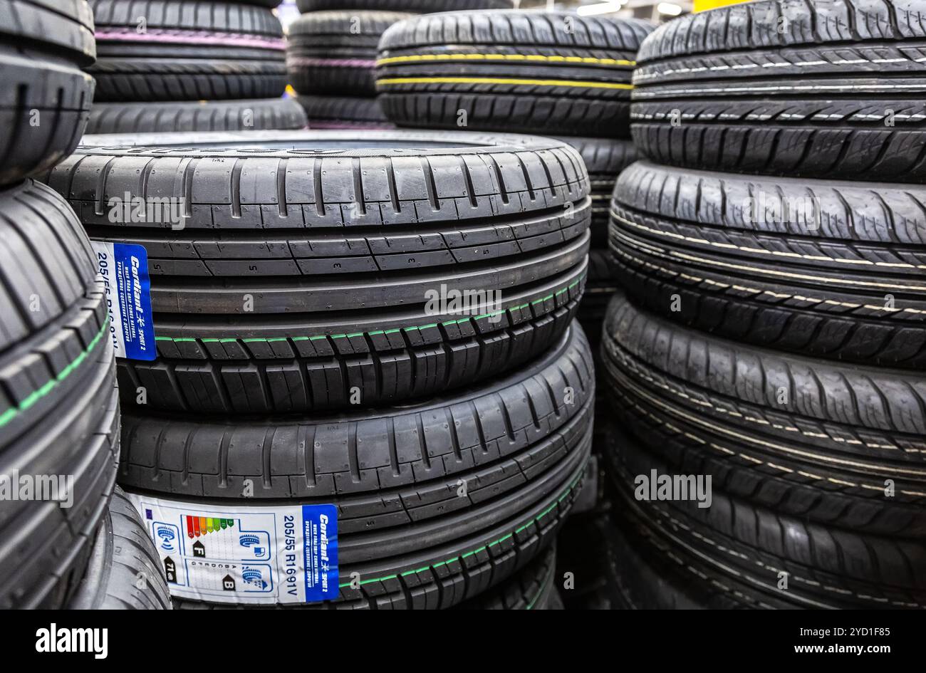 Summer vehicle tires stacked up for sale in hypermarket Stock Photo - Alamy