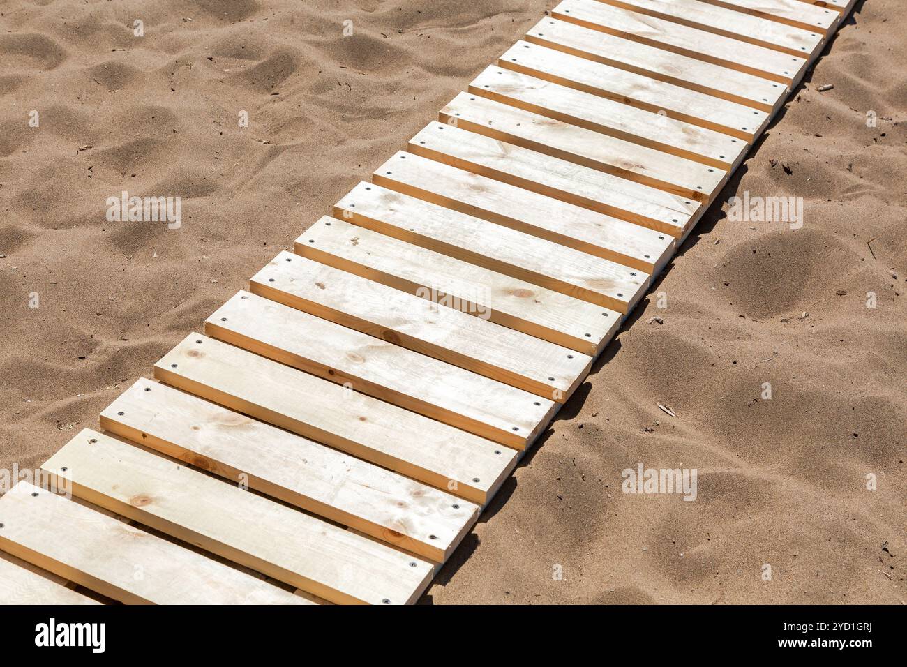 Small wooden bridge on the sand Stock Photo - Alamy
