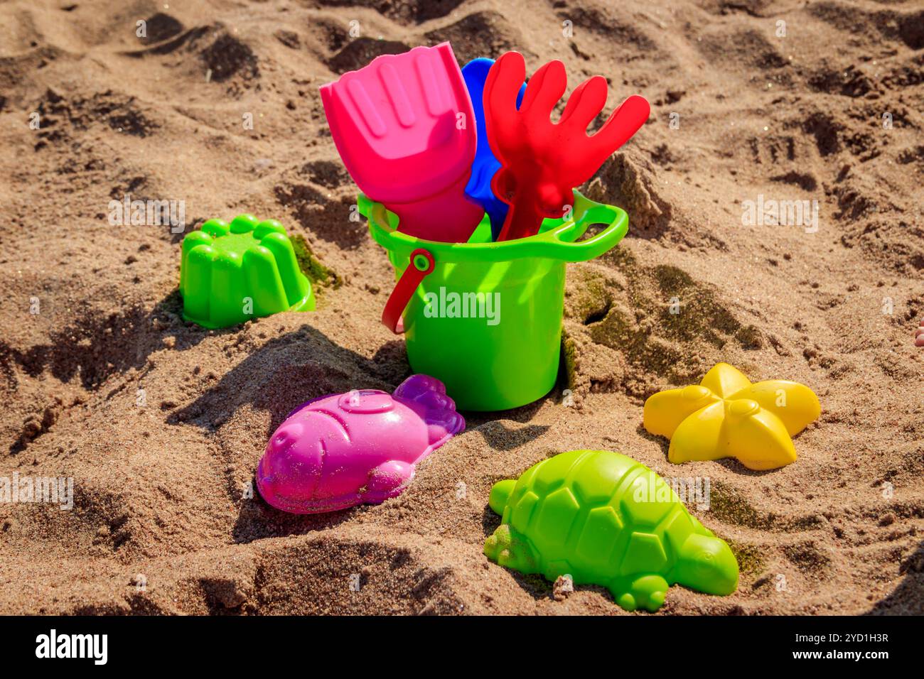 Sand bucket and shovels on sand. Children's games. Sand games Stock ...