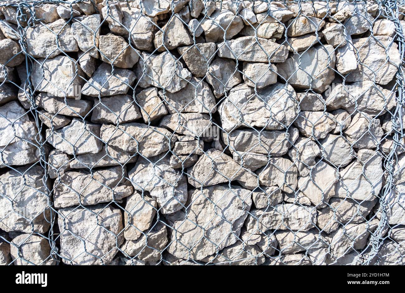 Stone wall with metal grid as background texture Stock Photo - Alamy