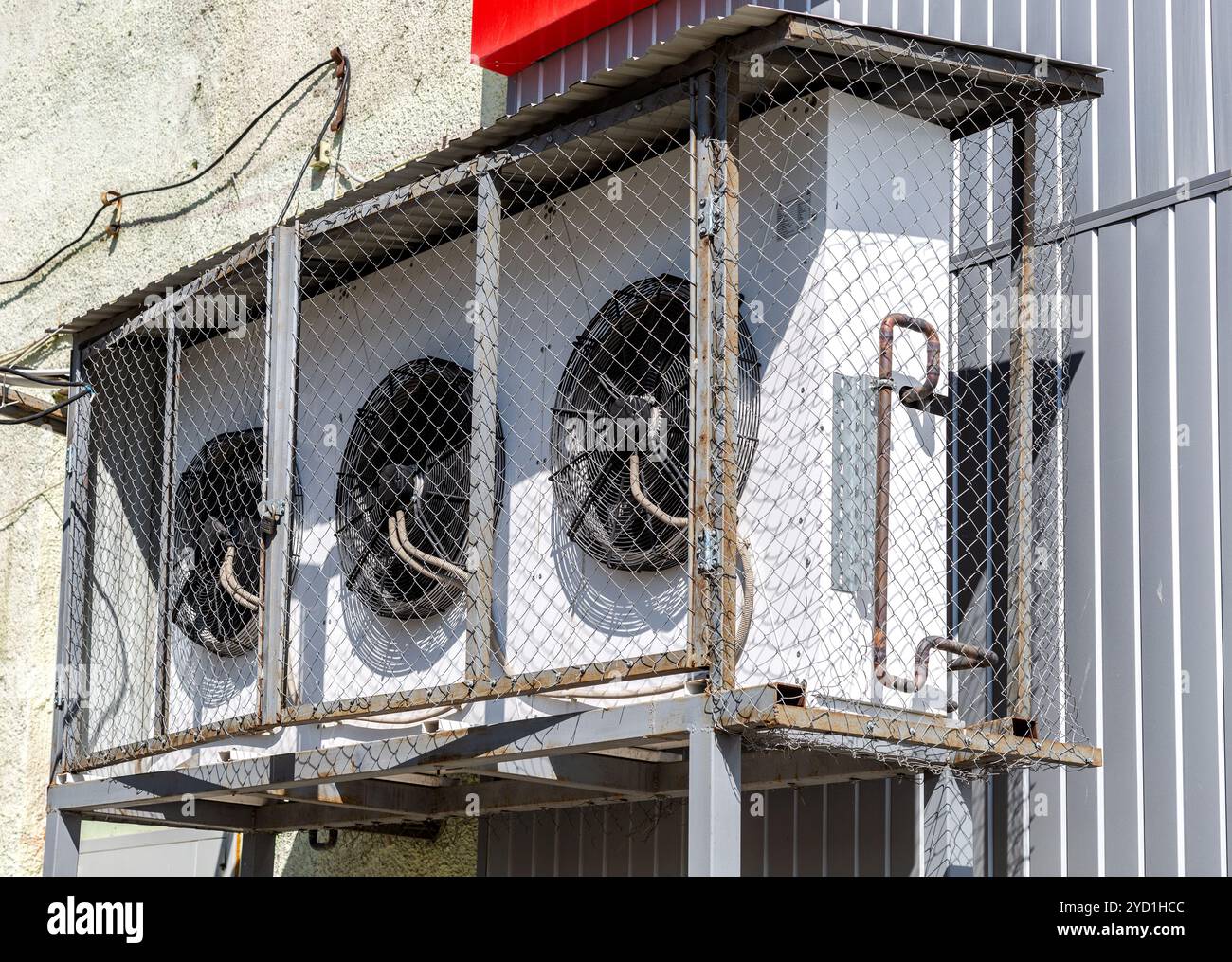 Industrial air conditioners hang on the wall Stock Photo - Alamy