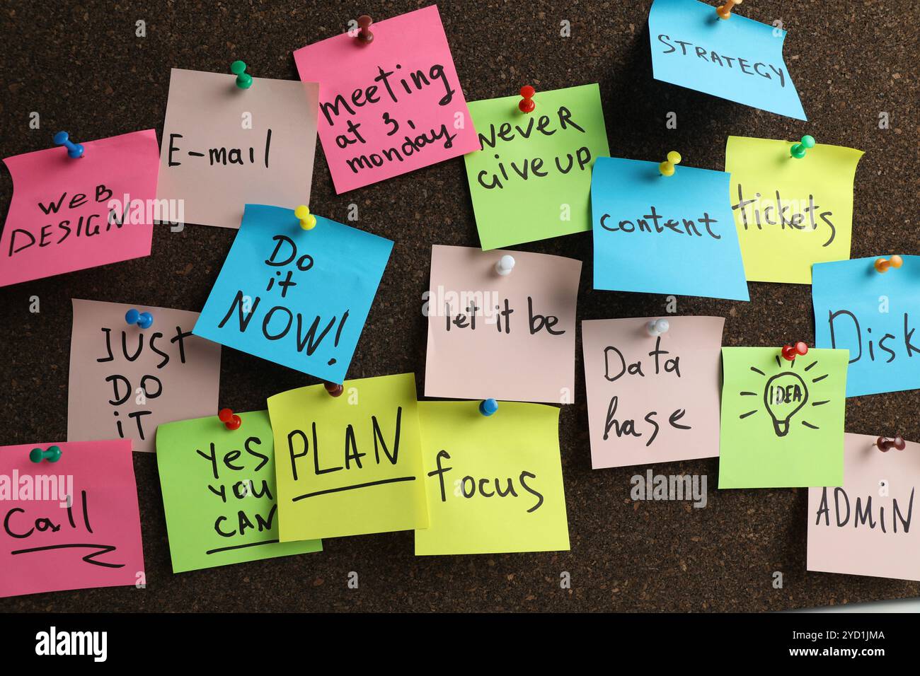 Colorful reminder notes pinned to cork board Stock Photo - Alamy