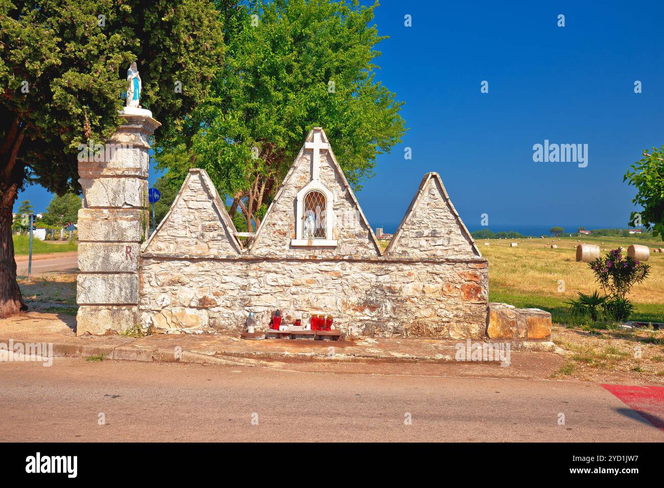 Religious stone monument in Dajla view Stock Photo - Alamy
