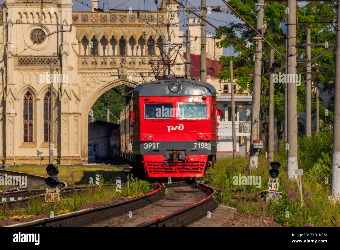 Russian train in the summer. The train is coming to the station ...