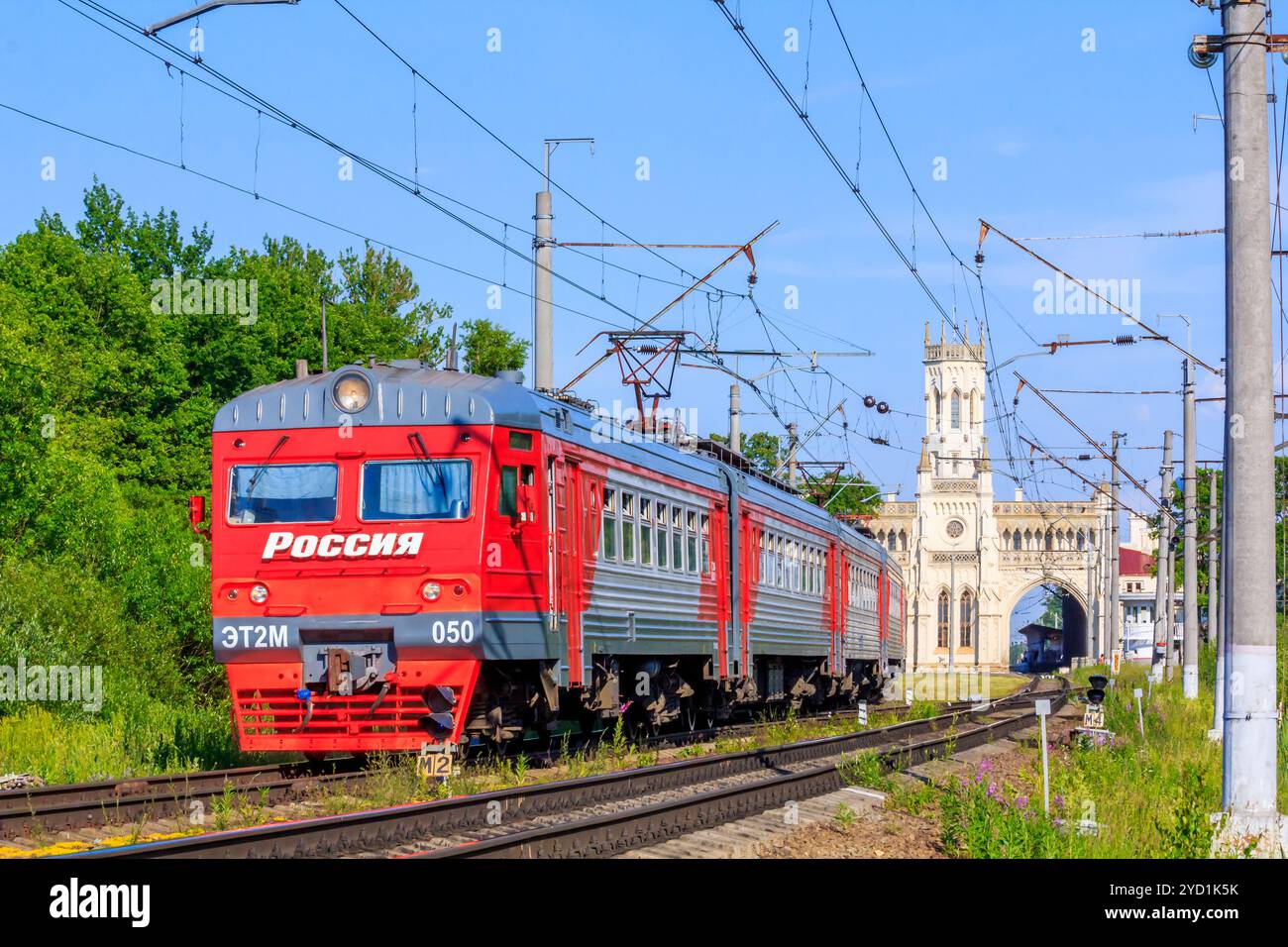 Russian train in the summer. The train is coming to the station ...