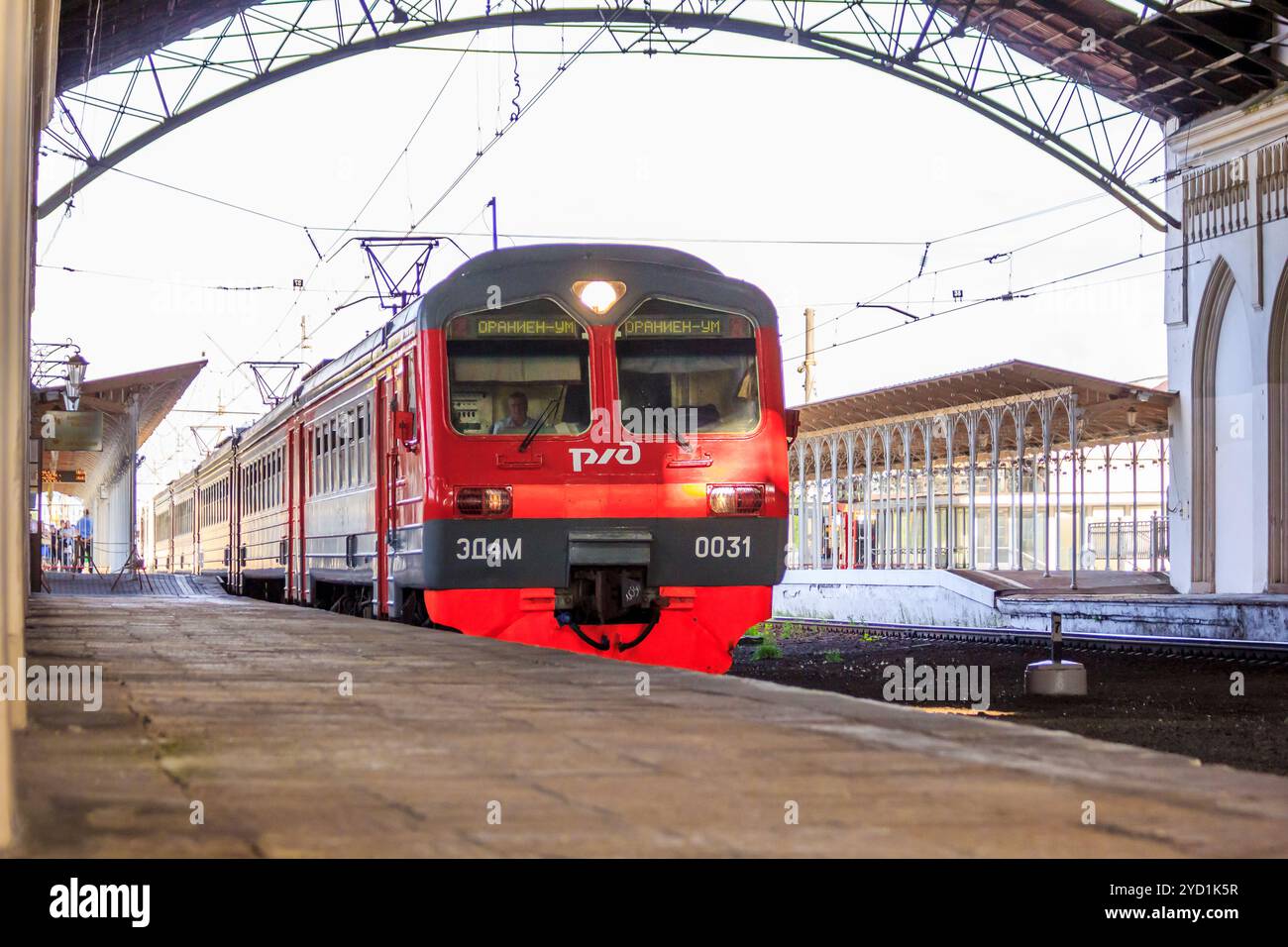 Russian train in the summer. The train is coming to the station. railway. Russia, Leningrad ...