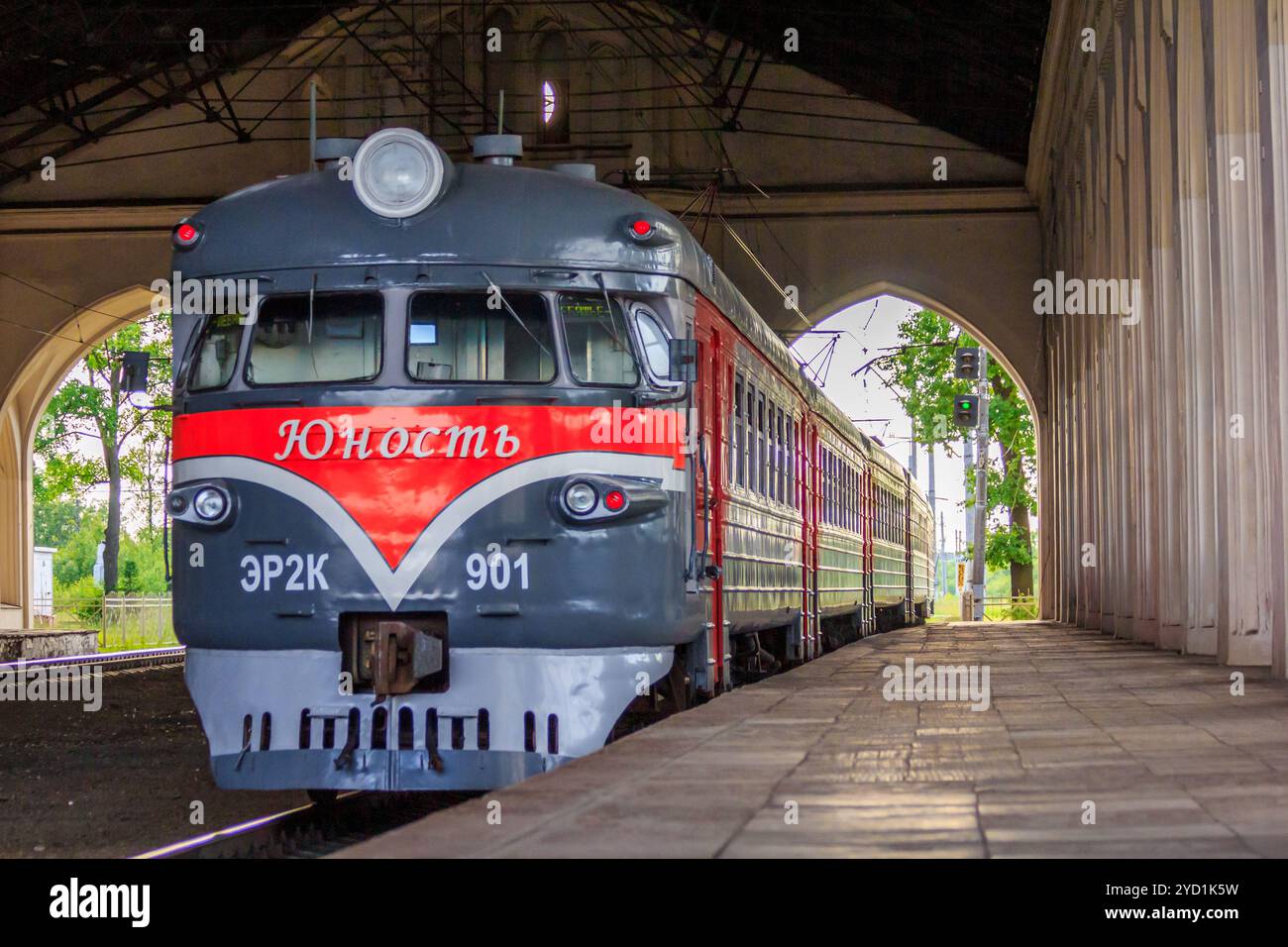 Russian train in the summer. The train is coming to the station ...